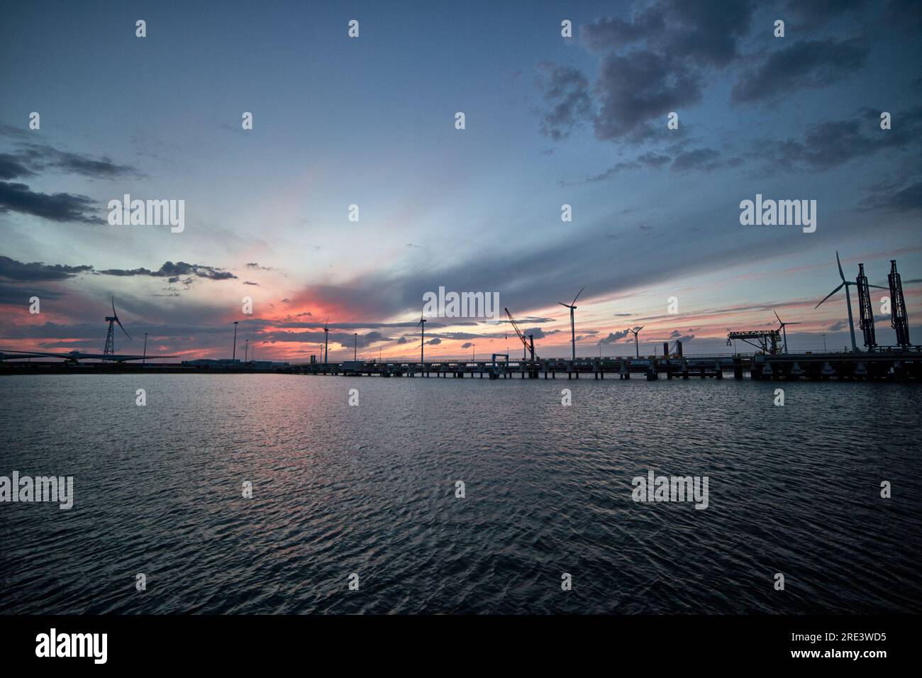 Sunset in port Stock Photo - Alamy