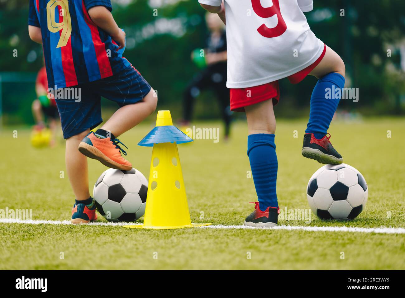 Two elementary-age children on football training. Little boys in ...
