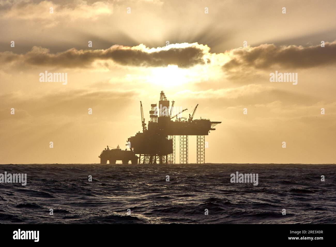 Silhouette of a jack up drilling rig in the North Sea at sunset Stock ...