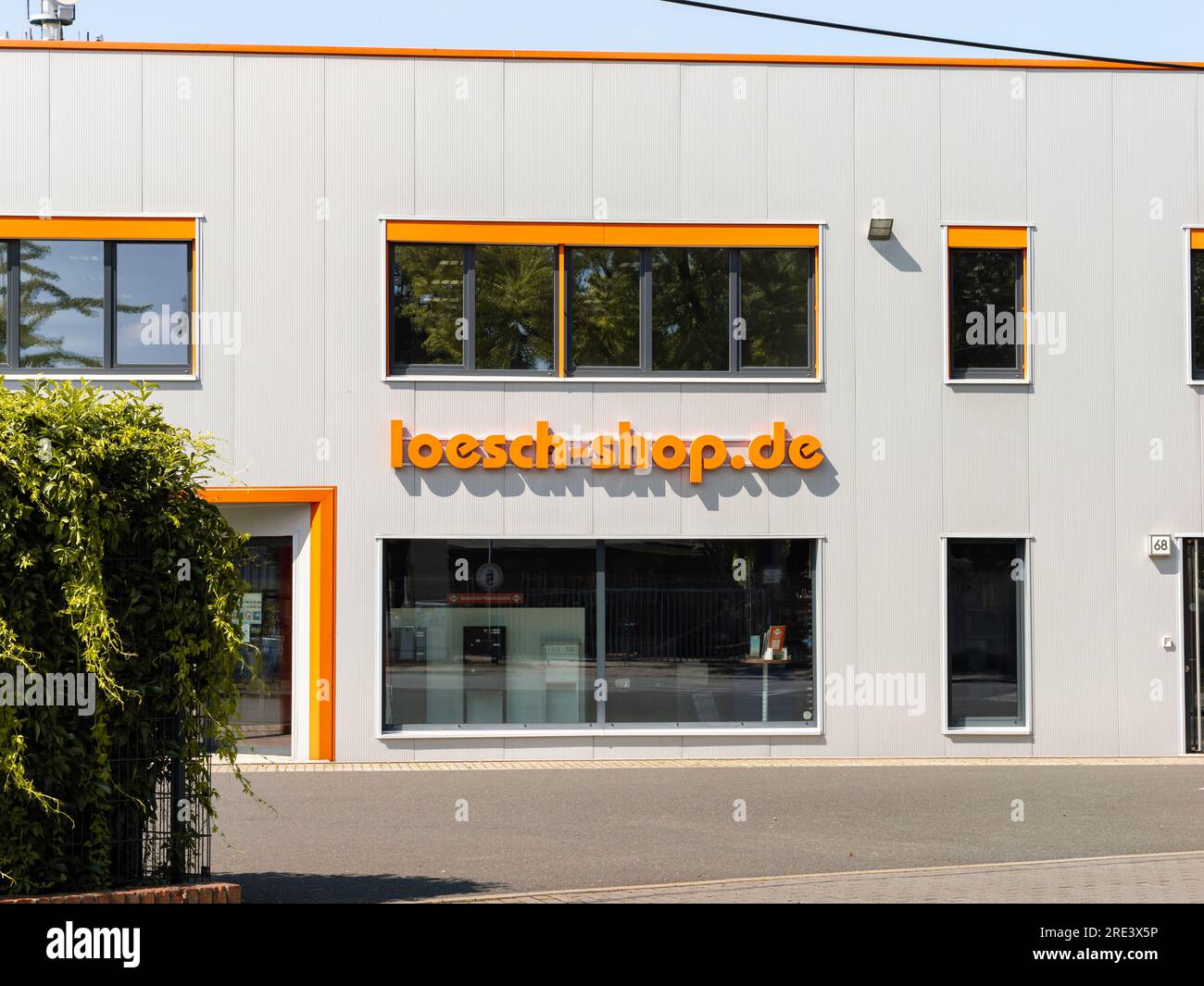 loesch-shop logo sign on the building exterior. The shop sells lumber ...