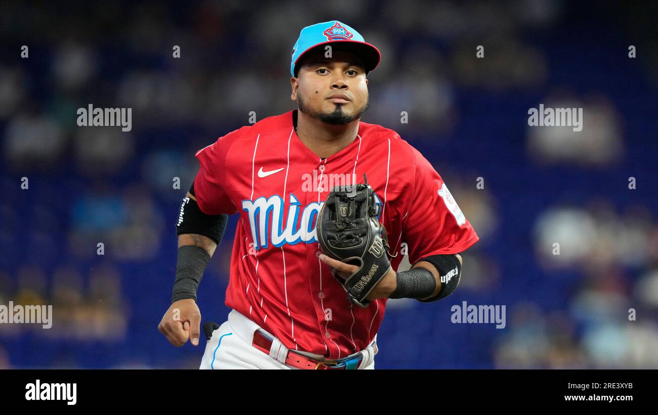 Miami Marlins second baseman Luis Arraez (3) runs back to the dugout ...