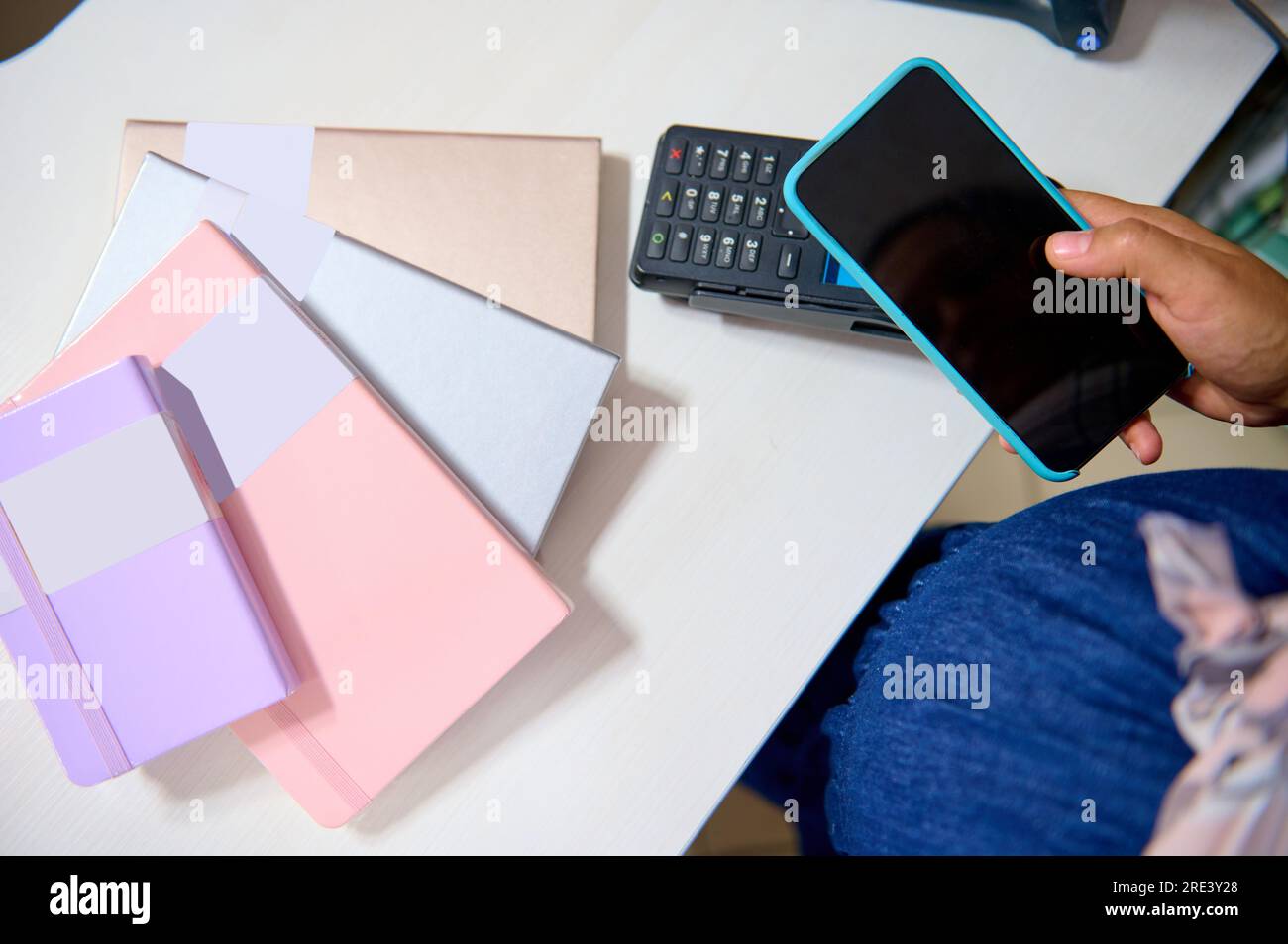 Close-up female hand holds modern smart mobile phone with blank empty ...