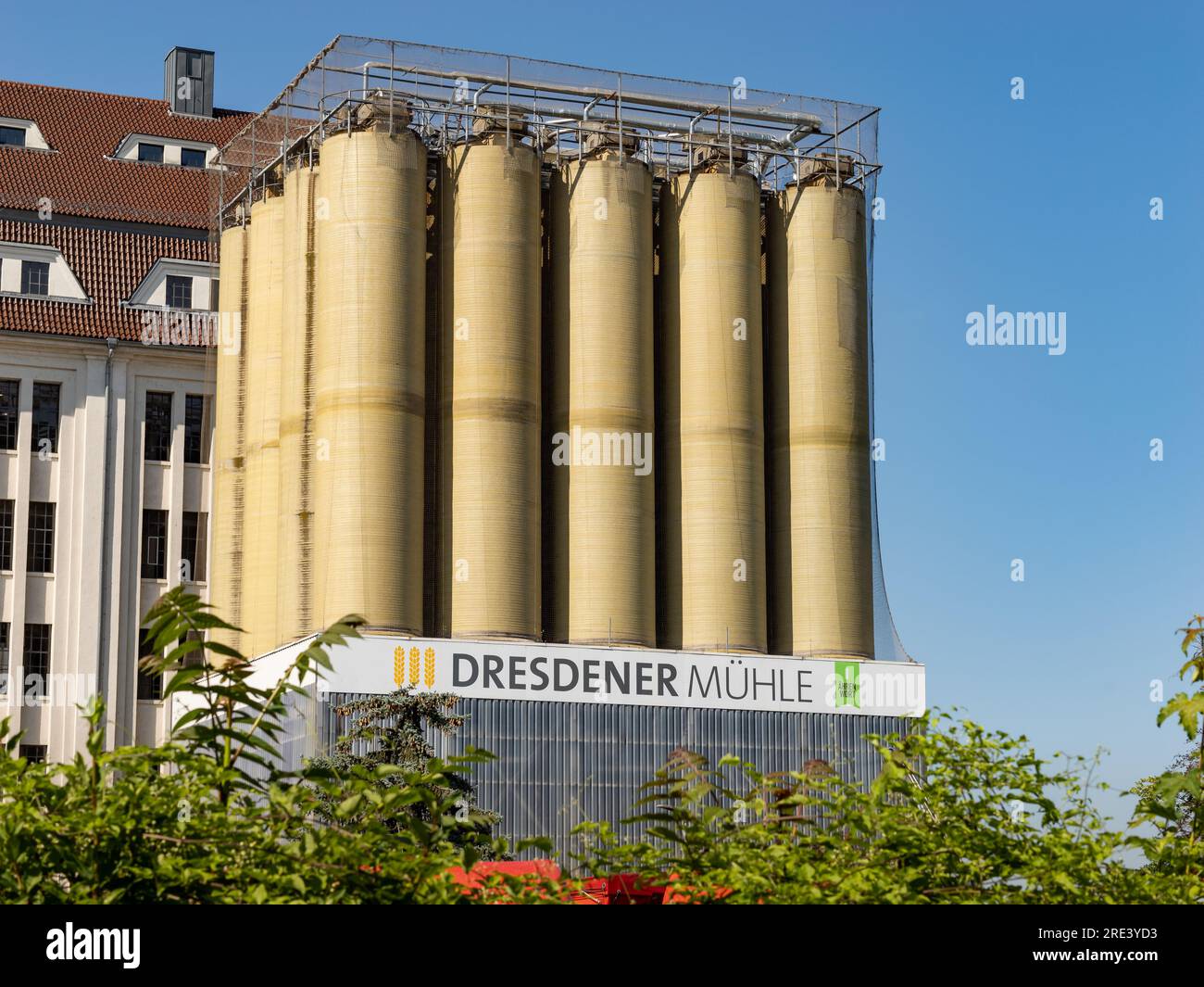 Dresdener Mühle (mill) logo sign on the building exterior. Industry ...