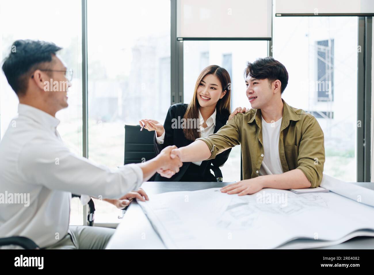 Engineers, designers and interior designers are handshake shack hands ...