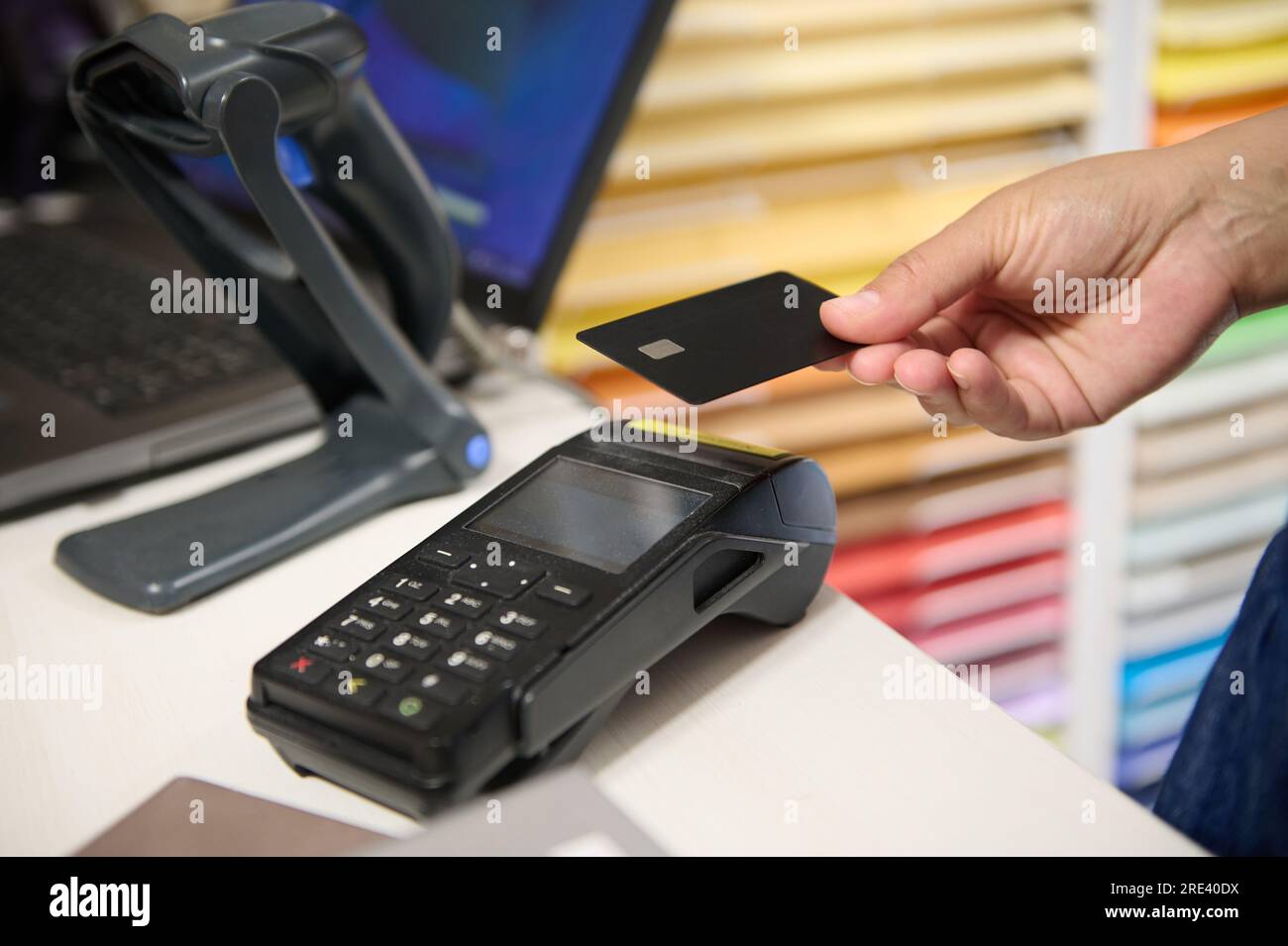 Woman holding a black blank mockup credit card with copy ad space ...