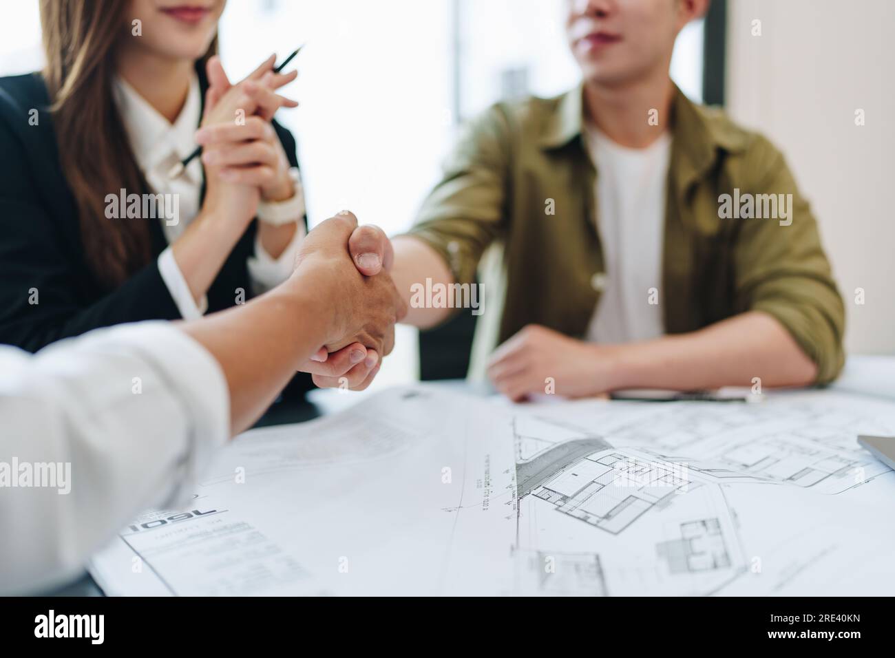 Engineers, designers and interior designers are handshake shack hands ...