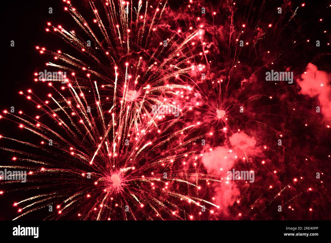 Close-up fireworks explode in the sky with motion blur on a black ...