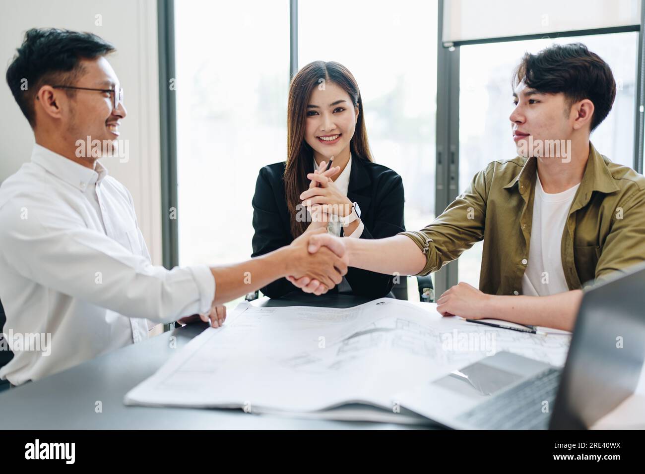 Engineers, designers and interior designers are handshake shack hands ...