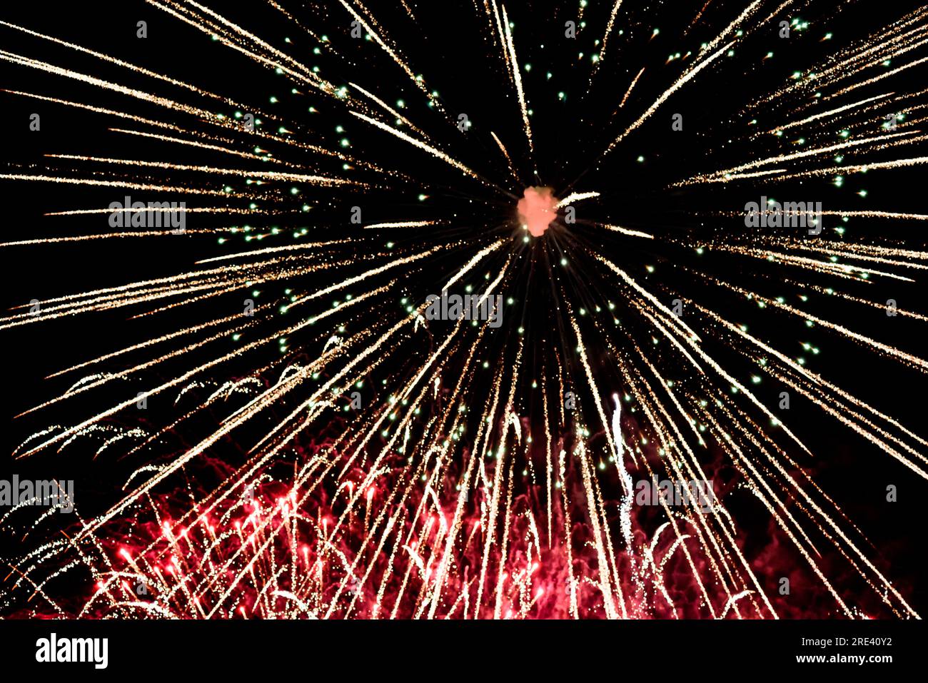 Close-up fireworks explode in the sky with motion blur on a black ...