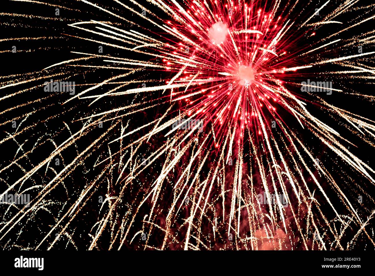 Close-up fireworks explode in the sky with motion blur on a black ...