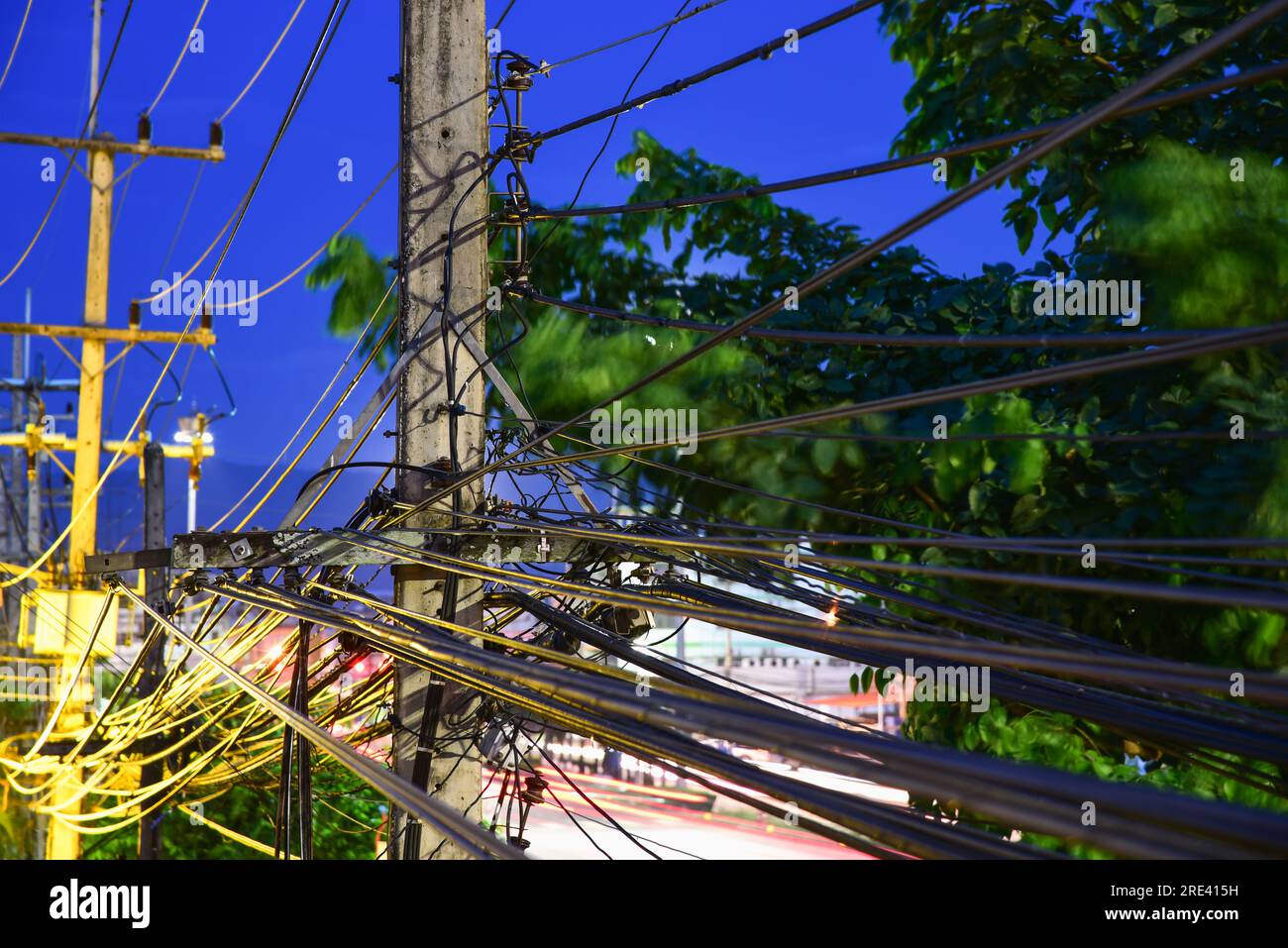 Electric line in the city night Stock Photo - Alamy