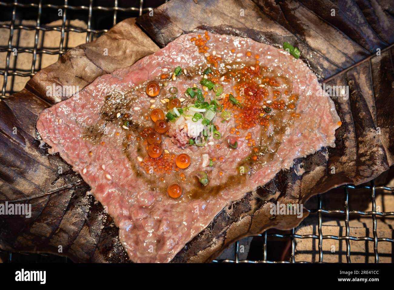 Japan beef grilled on oba leaves with stove background Stock Photo - Alamy