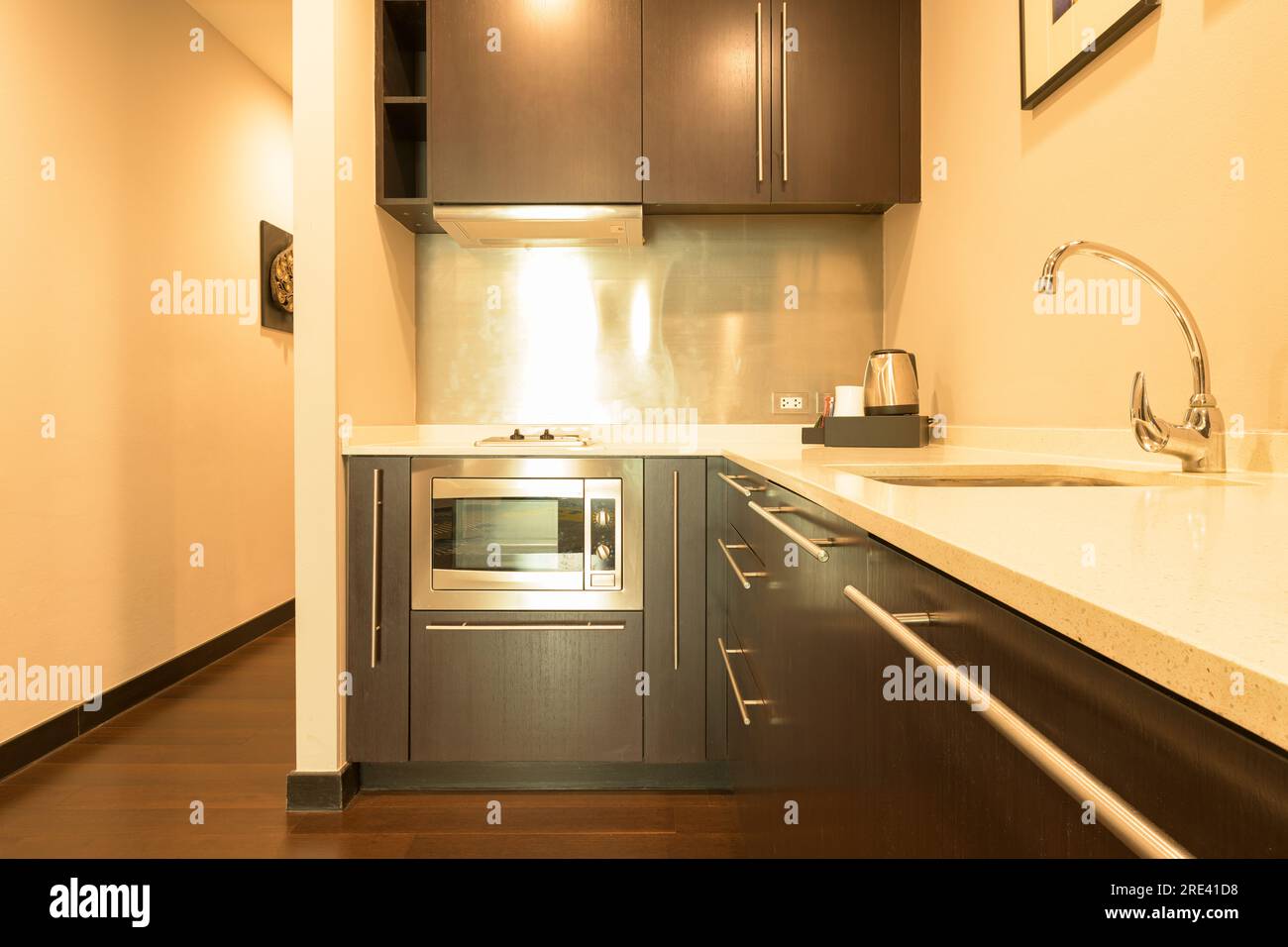 faucet and kettles in the kitchen Stock Photo - Alamy