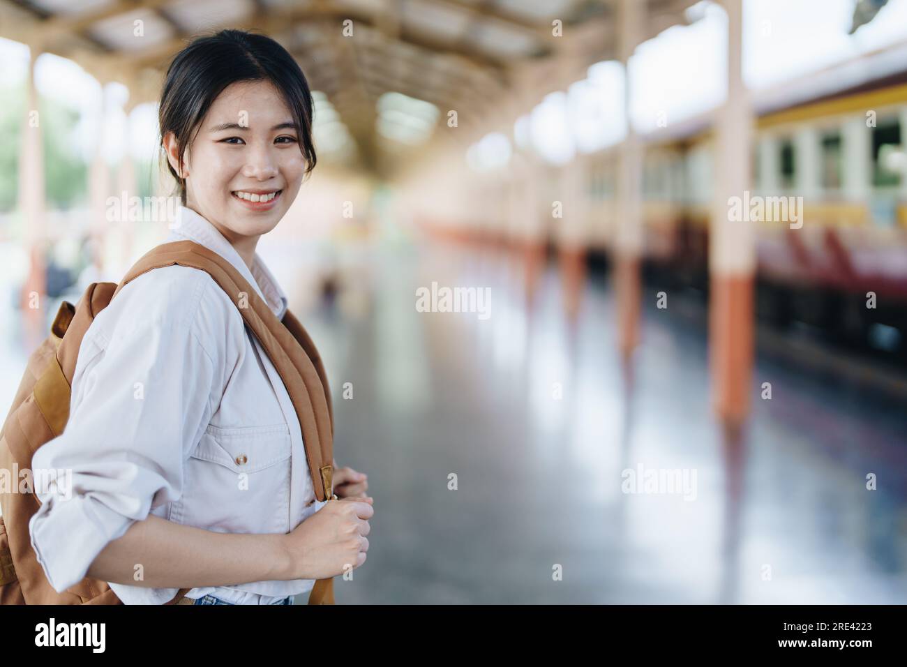 Tourists are showing happy expressions while waiting for their journey ...
