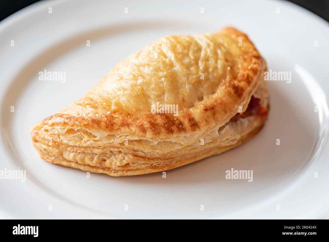 Barbecue pork pie on a white plate with black backgrounds Stock Photo ...