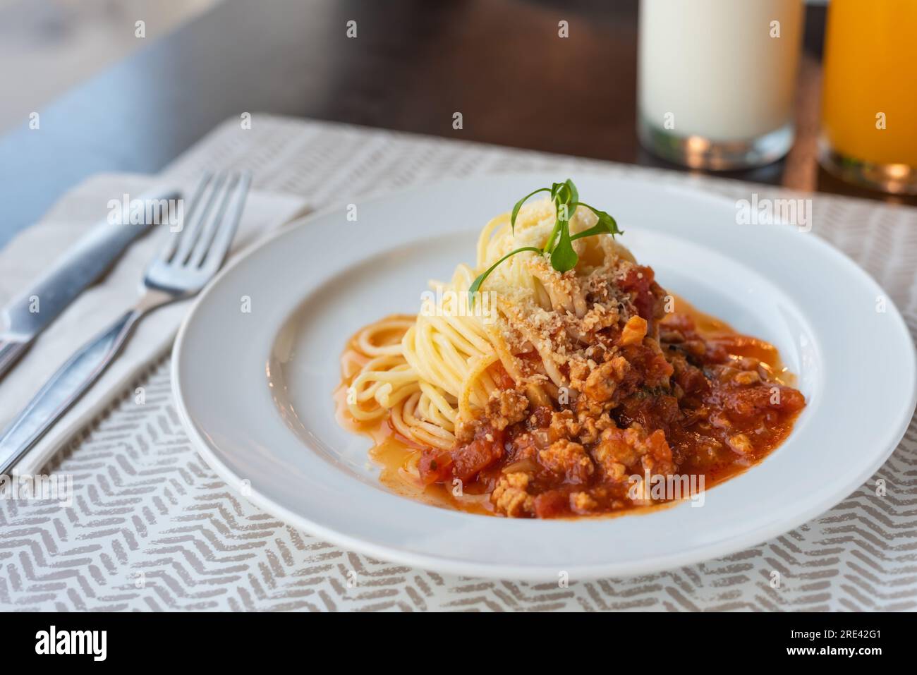 Spaghetti with meat souce on top was decorated on a dining table Stock ...