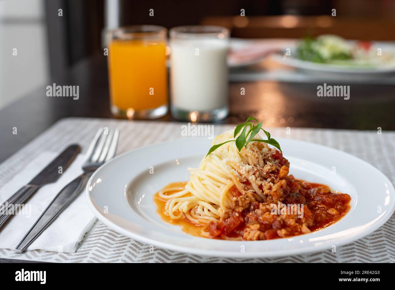 Spaghetti with meat souce on top was decorated on a dining table Stock ...