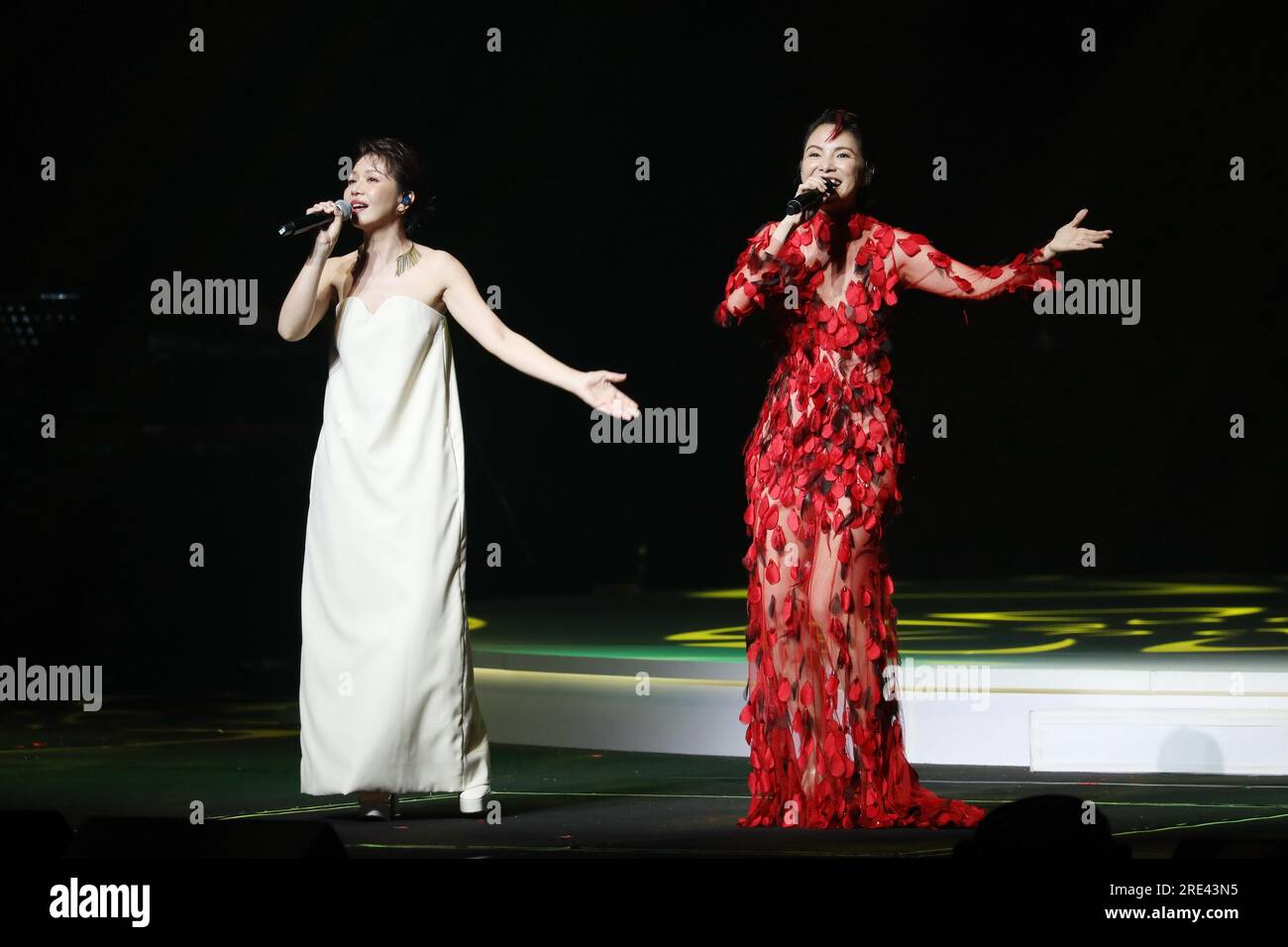 Malaysian film actress and pop singer Angelica Lee (right) holds ...