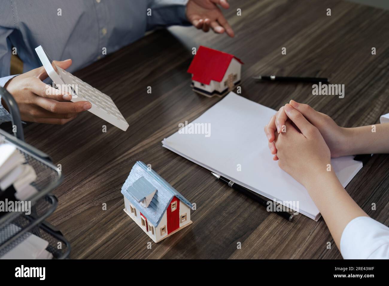 Real Estate Agent explain insurance and agreement contract to client ...