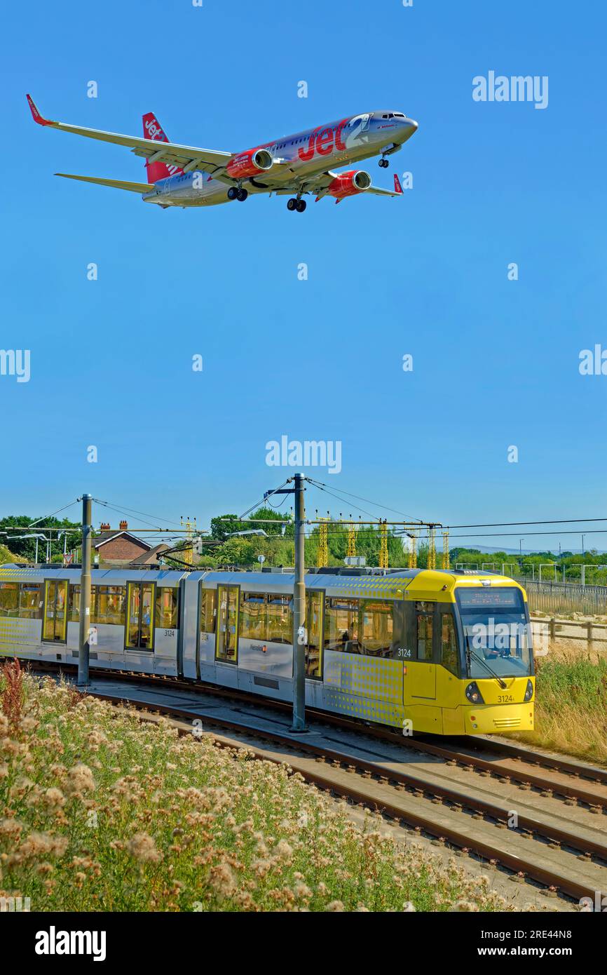 Manchester Metrolink tram approaching the Manchester Airport station ...