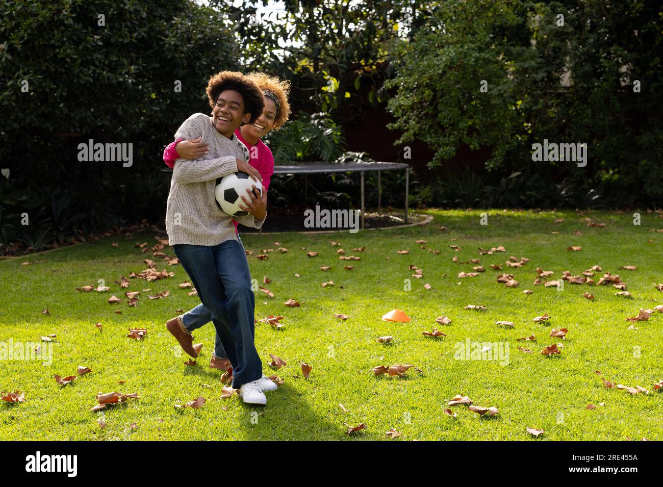 Cheerful mother son football hi-res stock photography and images - Alamy