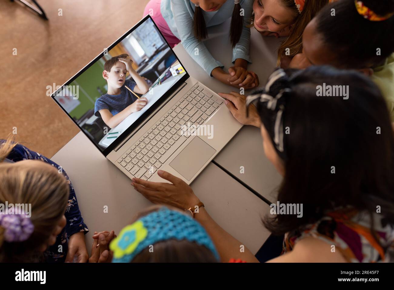 Asian female teacher and diverse students having a video call with ...