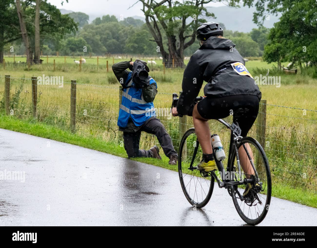 A veteran triathlete being photographed during the Ullswater 'Sprint ...