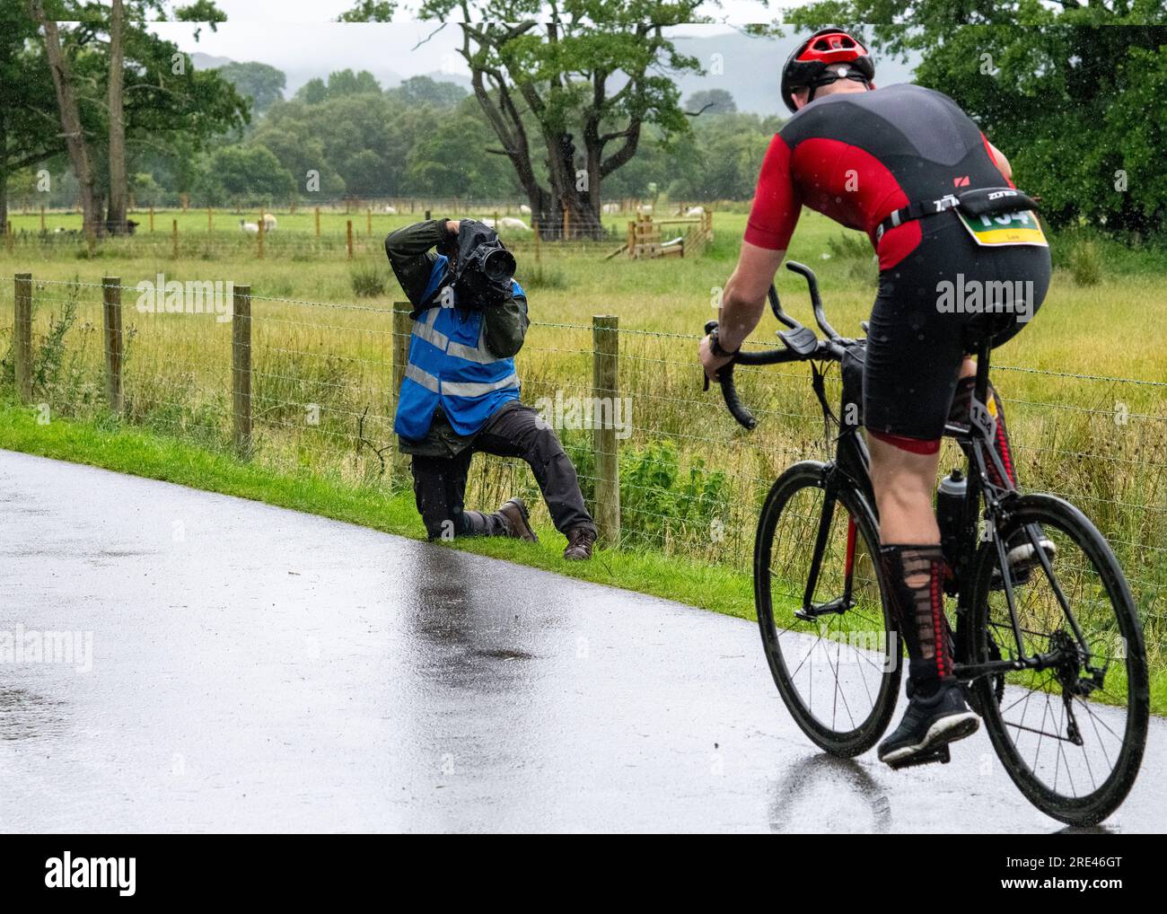 An 'Ullswater half-ironman' triathlete being photographed at the start of the cycle ride, Lake ...