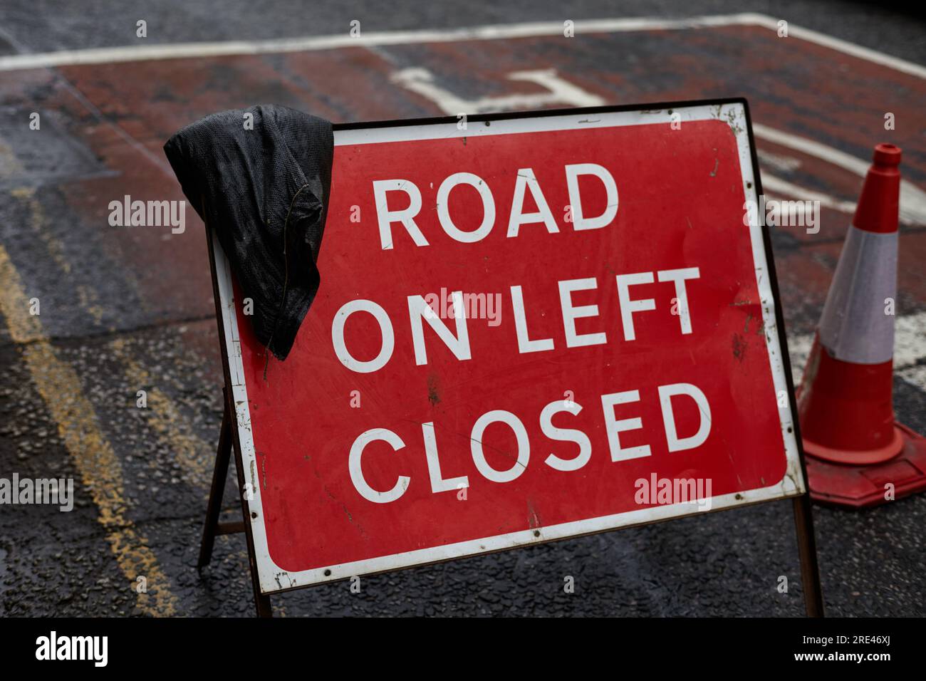 Road on left closed sign on main street in the city Stock Photo - Alamy