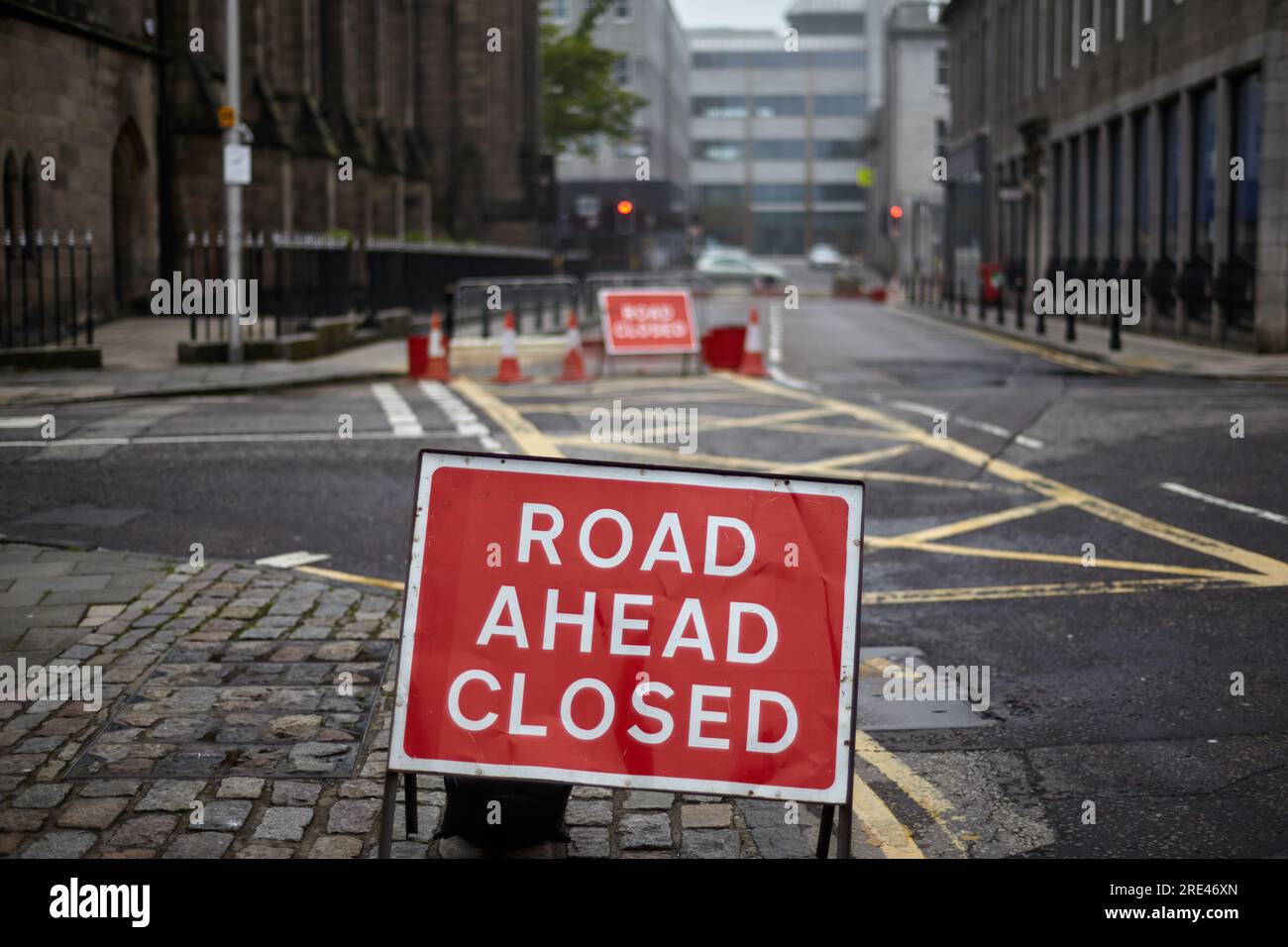 Road ahead closed sign on empty Main Street in the city Stock Photo - Alamy