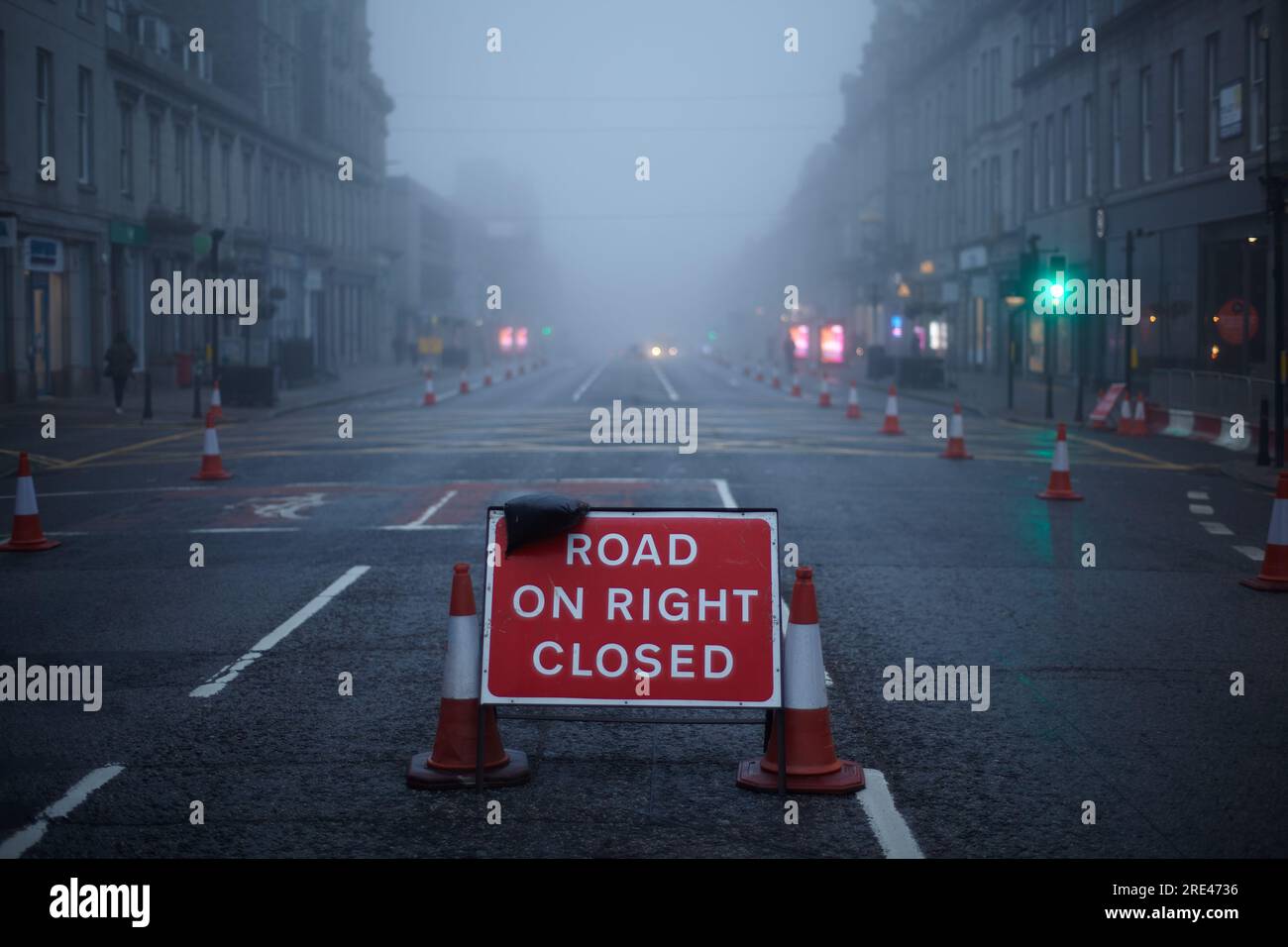 Road on right closed sign in empty city with street lights Stock Photo ...