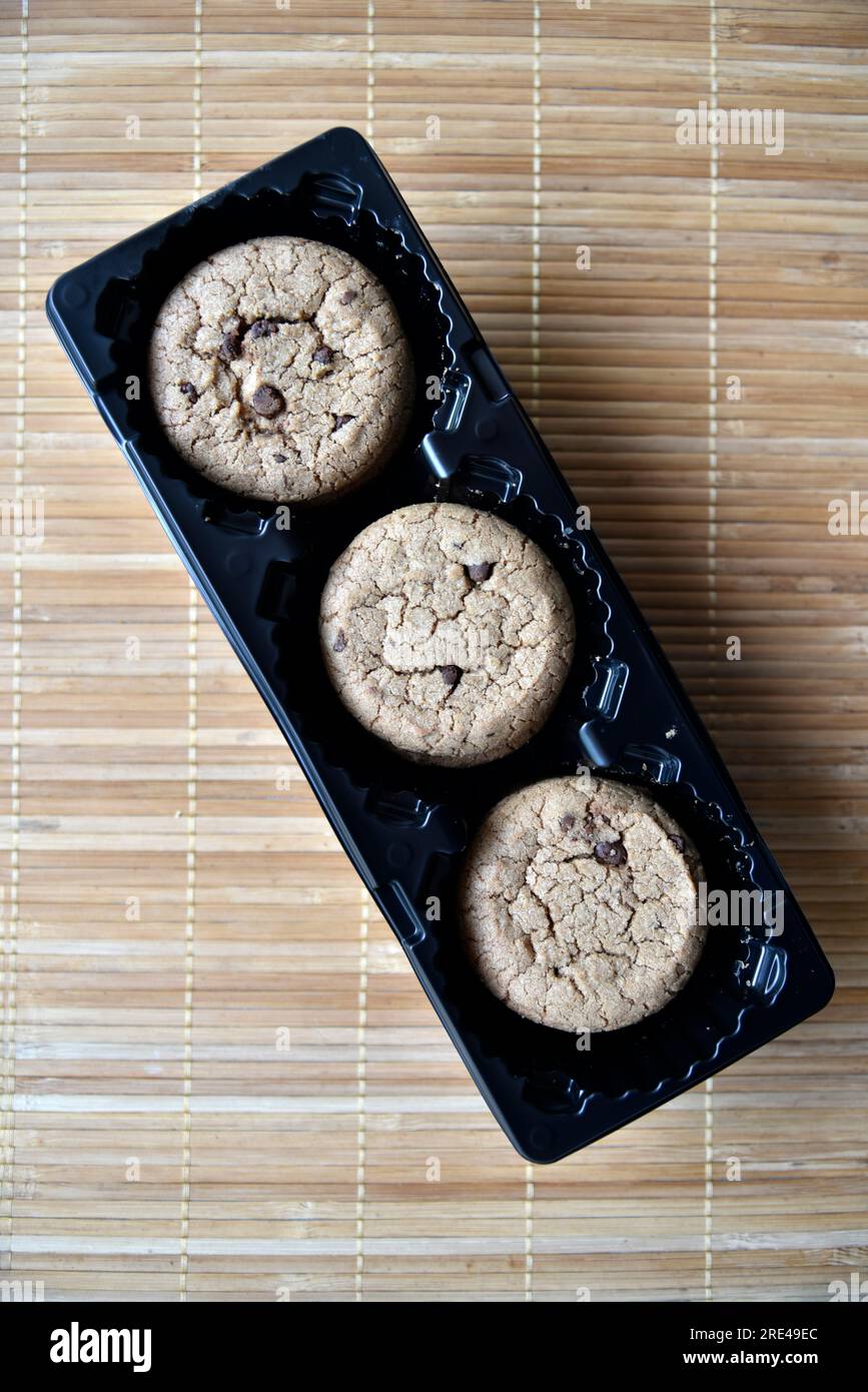 Oatmeal cookies with chocolate packed on a mat. Blank packaging Stock ...