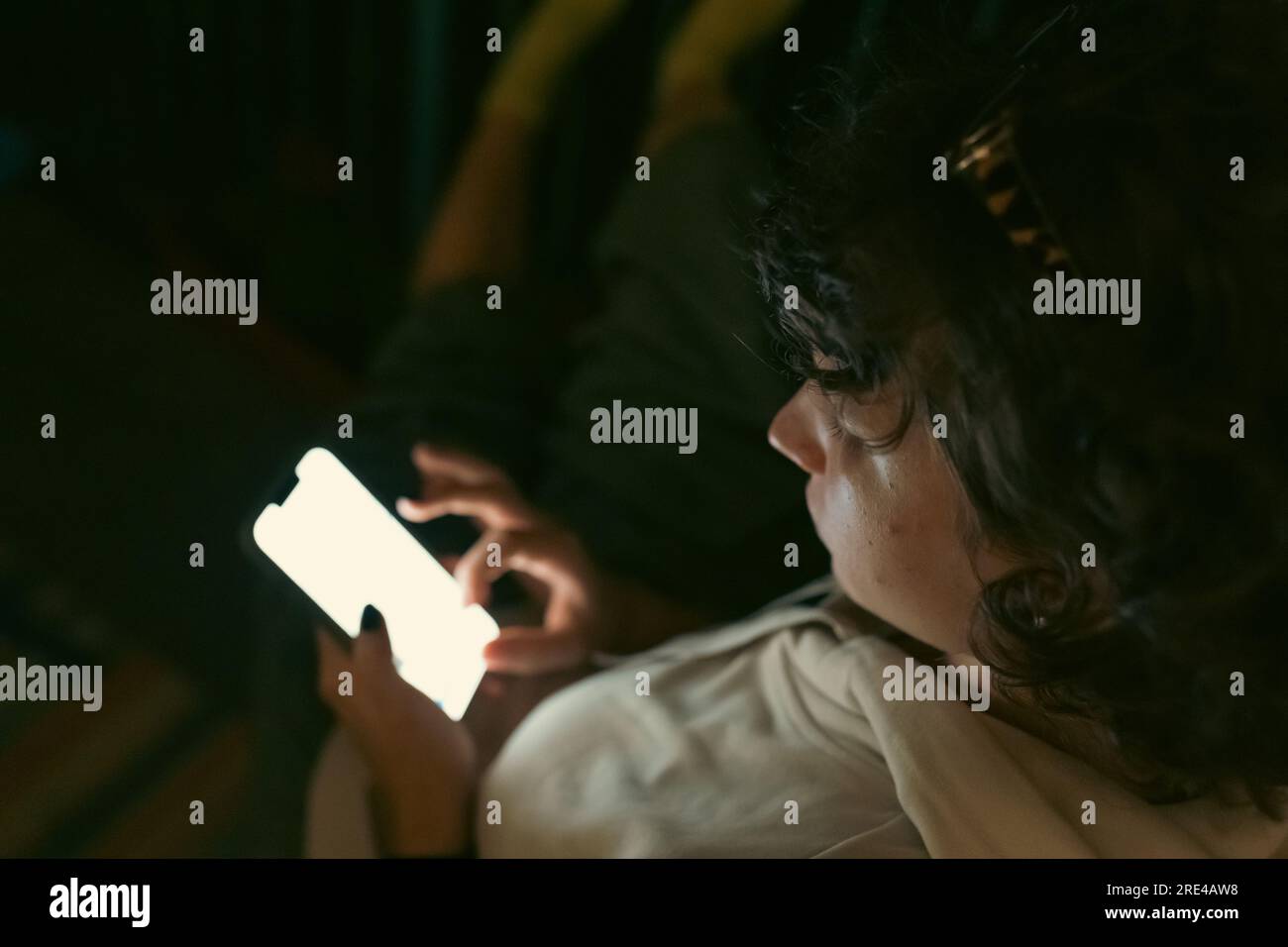 using mobile apps technology on cell phone late at night Stock Photo ...