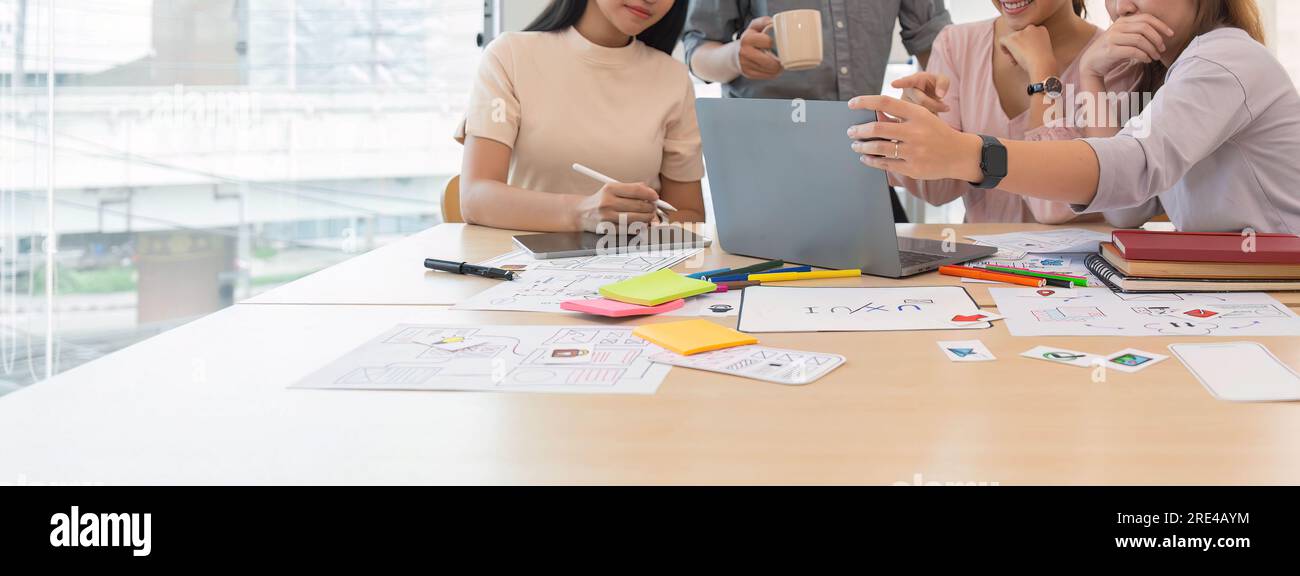 ux developer and ui designer presenting and testing mobile app ...