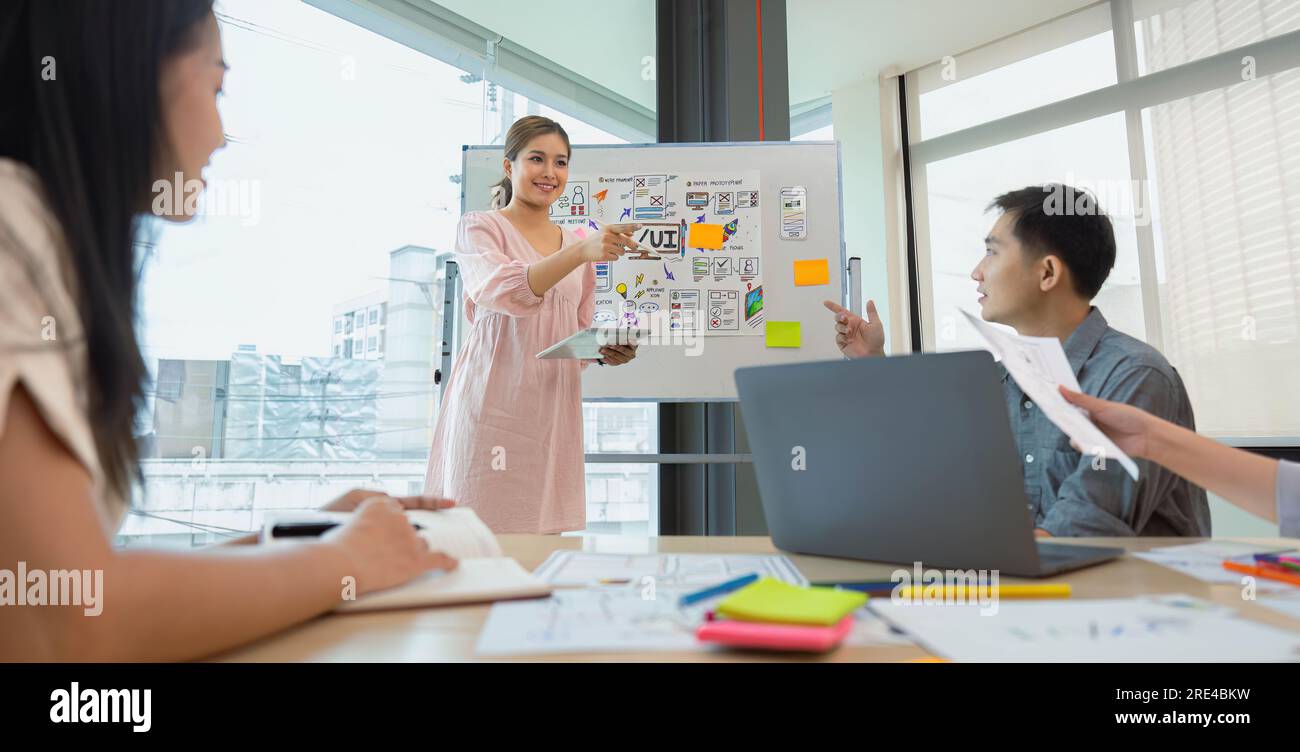 ux developer and ui designer presenting and testing mobile app ...