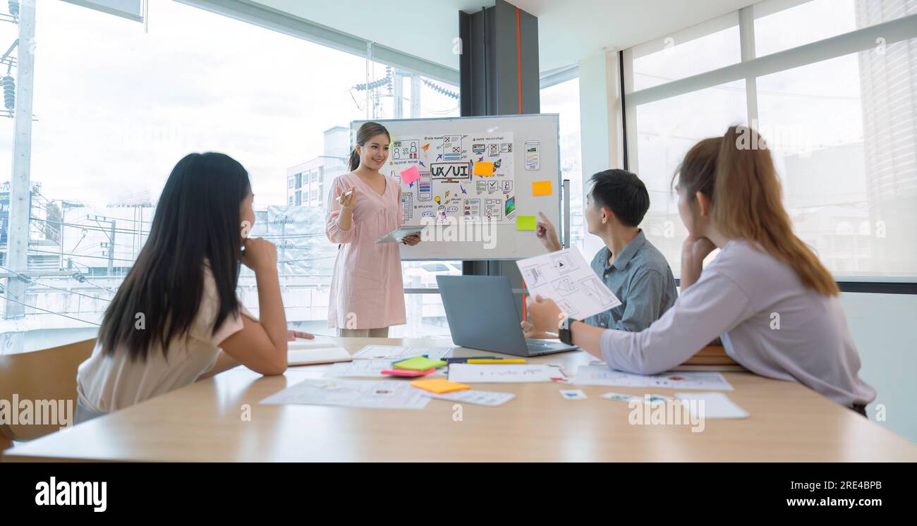 ux developer and ui designer presenting and testing mobile app ...