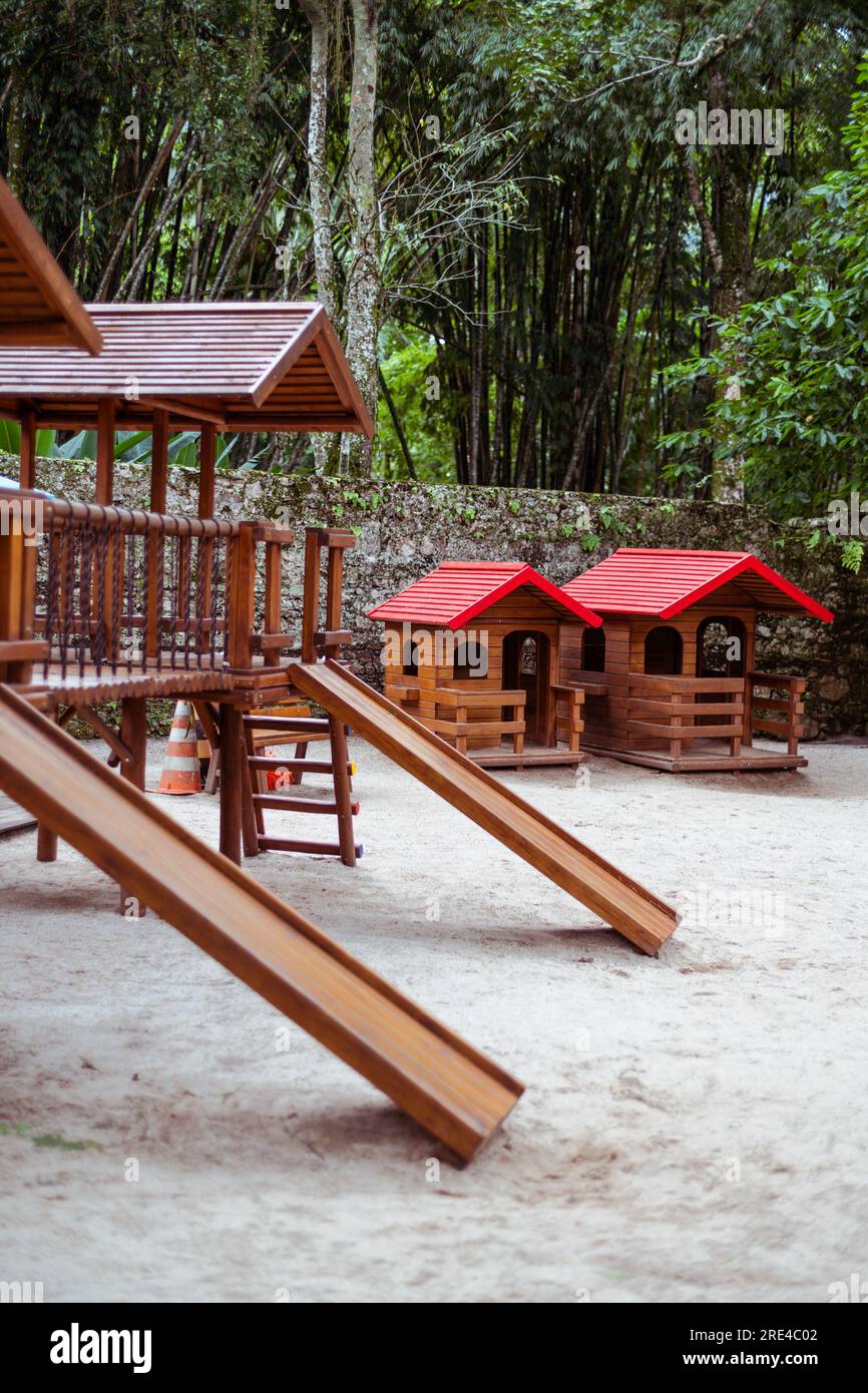A vertical shot of a playground in a tropical setting with a selective ...