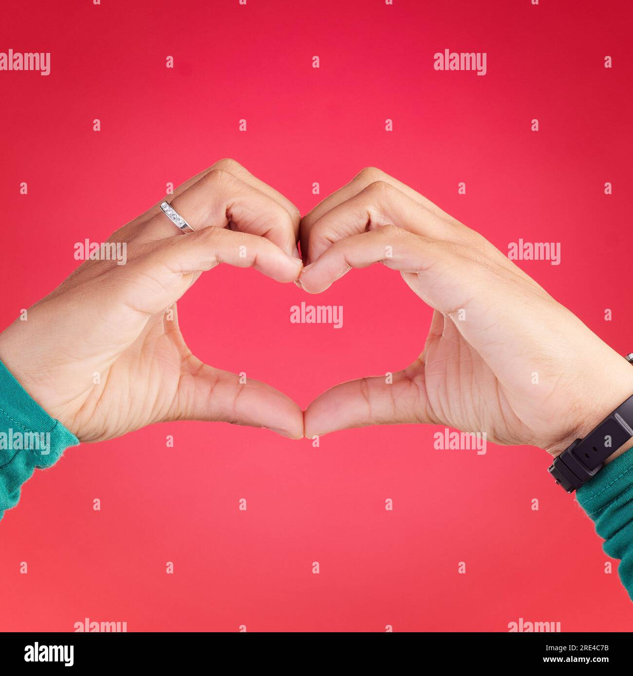 Closeup, person and heart hands for love, care or compassion against a ...