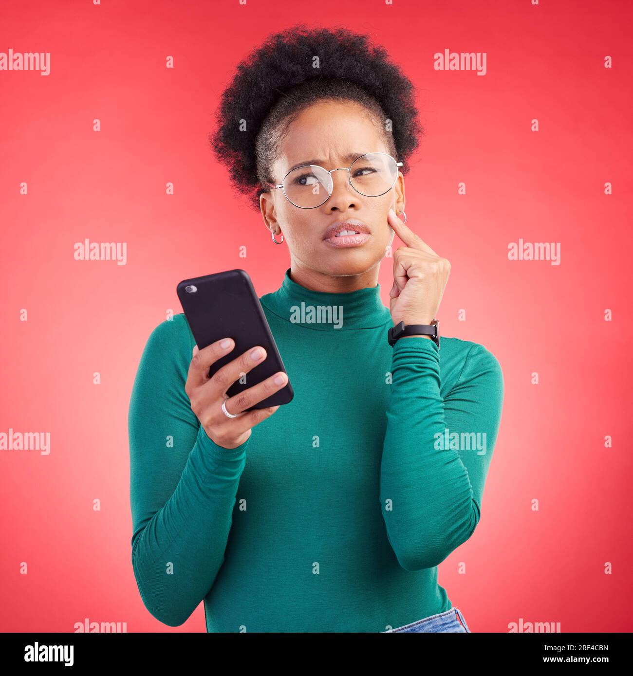 Thinking, phone and black woman in studio confused by text, application ...