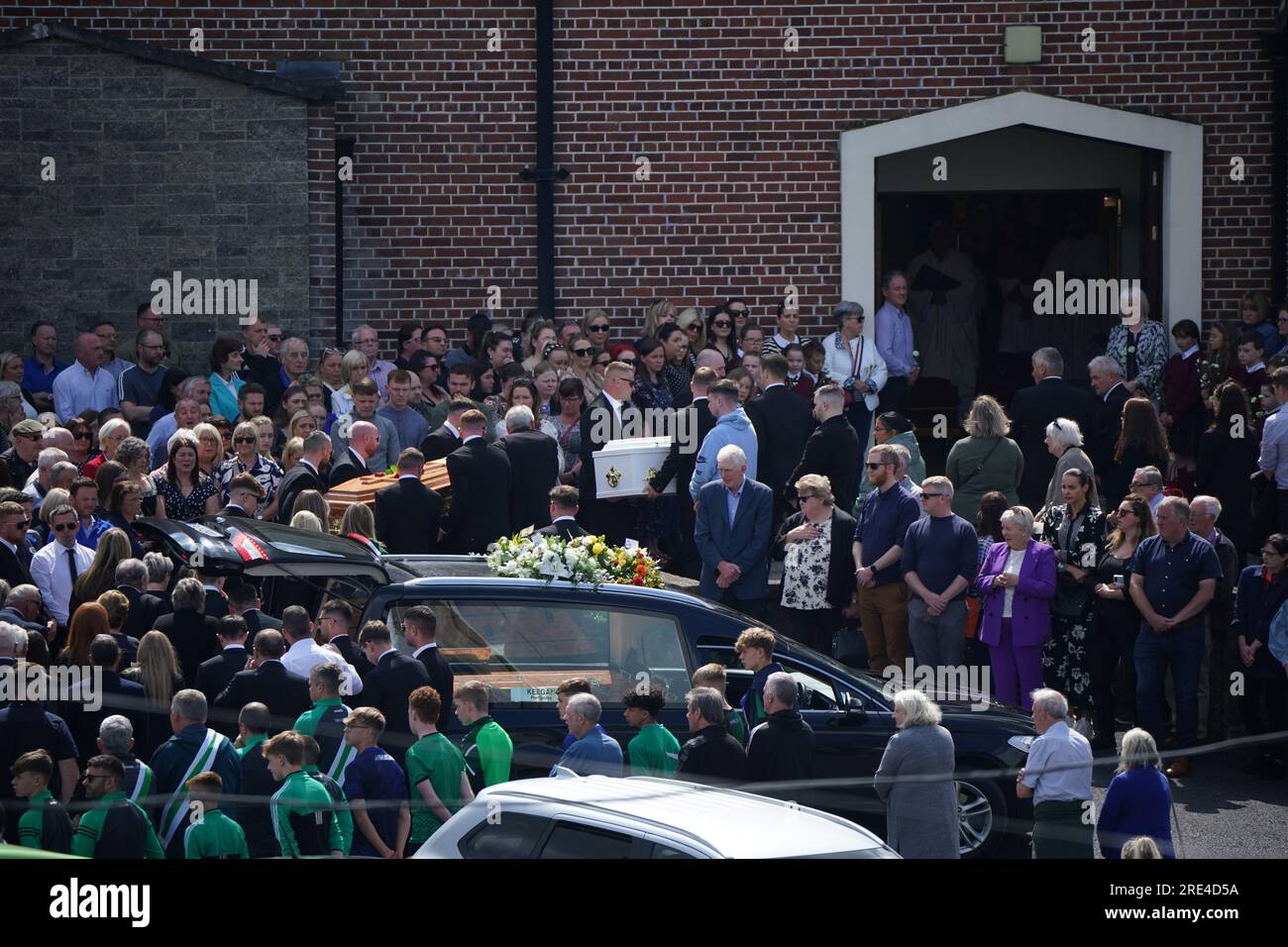 The coffins of father and son Eoin and Dylan Fitzpatrick are carried ...