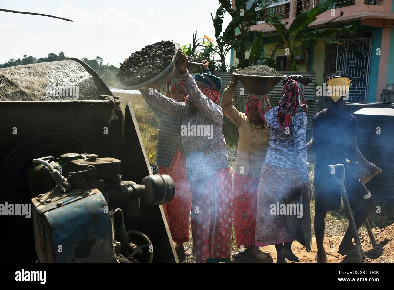 Indian people working at a construction site amidst tough working ...