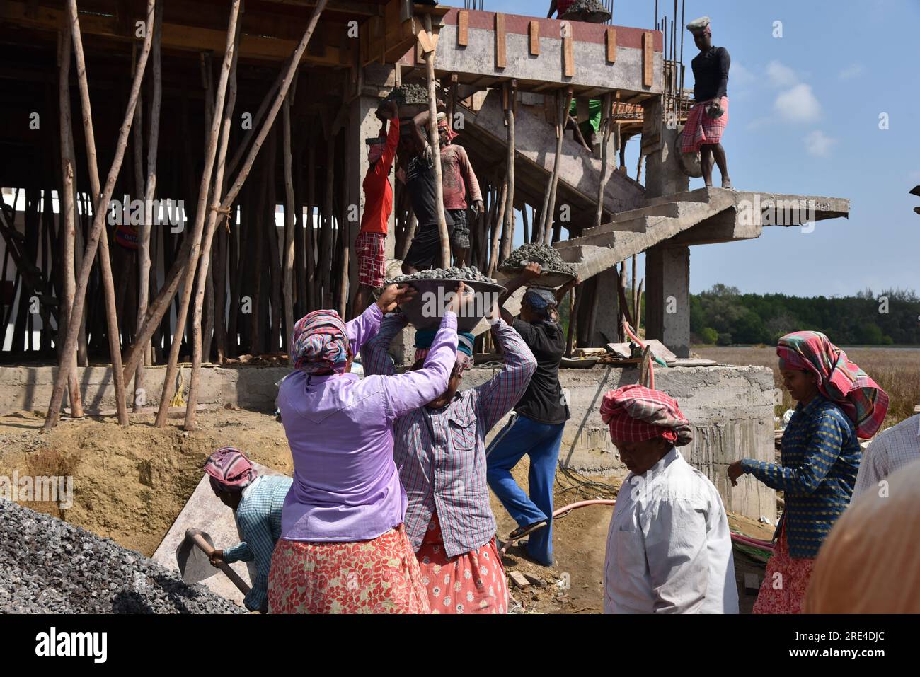 Indian people working at a construction site amidst tough working ...
