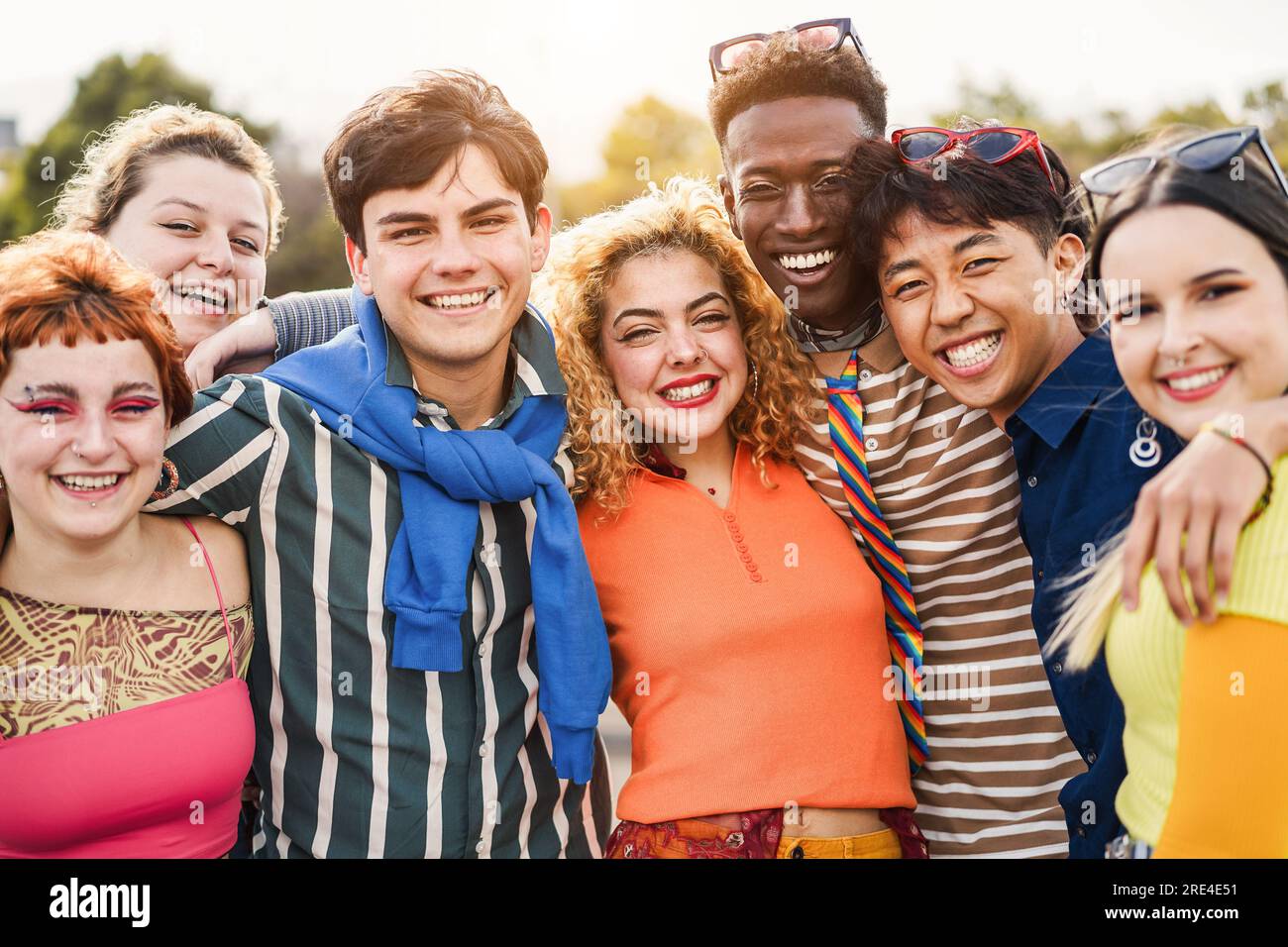 Young diverse people having fun together outdoor smiling on camera ...