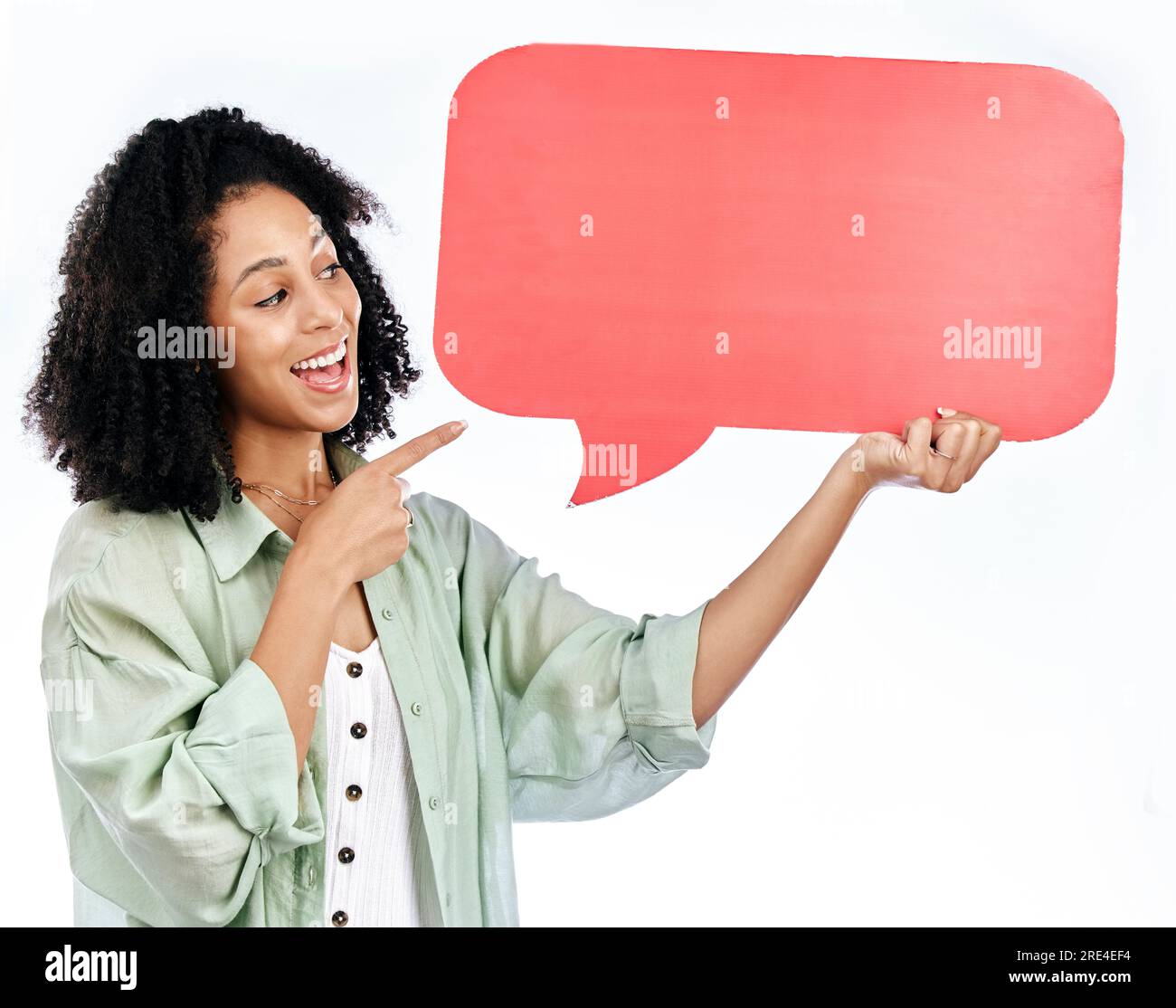 Woman, smile and hand pointing to speech bubble in studio for social ...