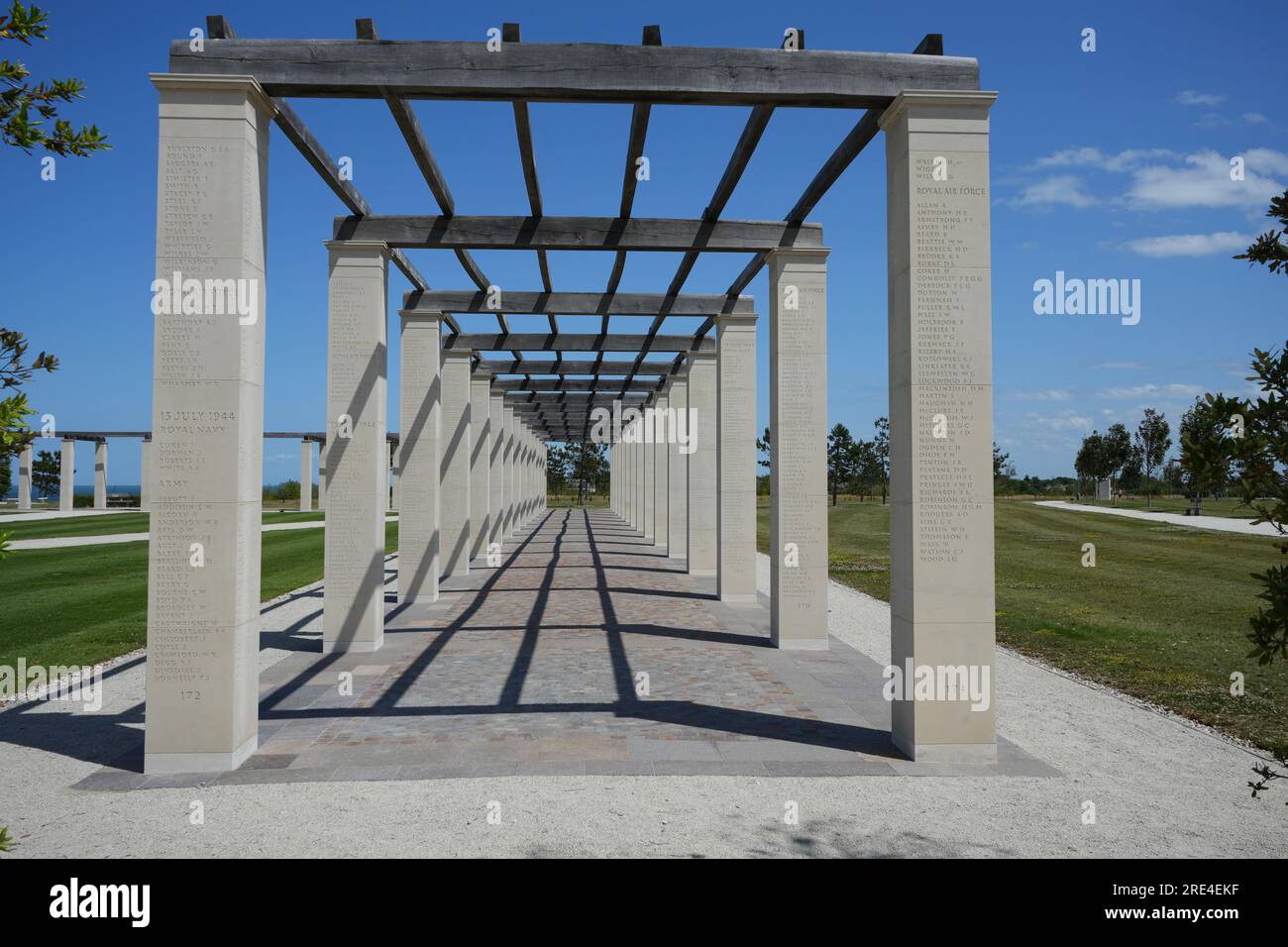 Stone Walkways at The British Normandy Memorial, with blus skies above ...