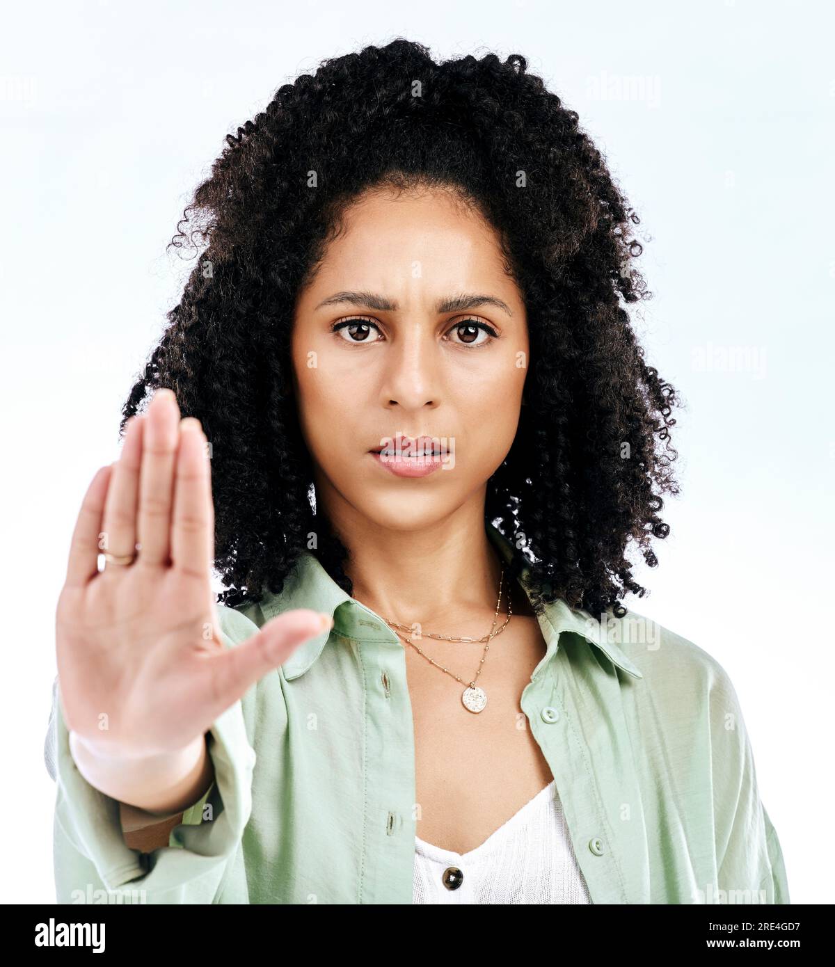 Stop, hand and portrait of woman in studio with warning, sign and ...