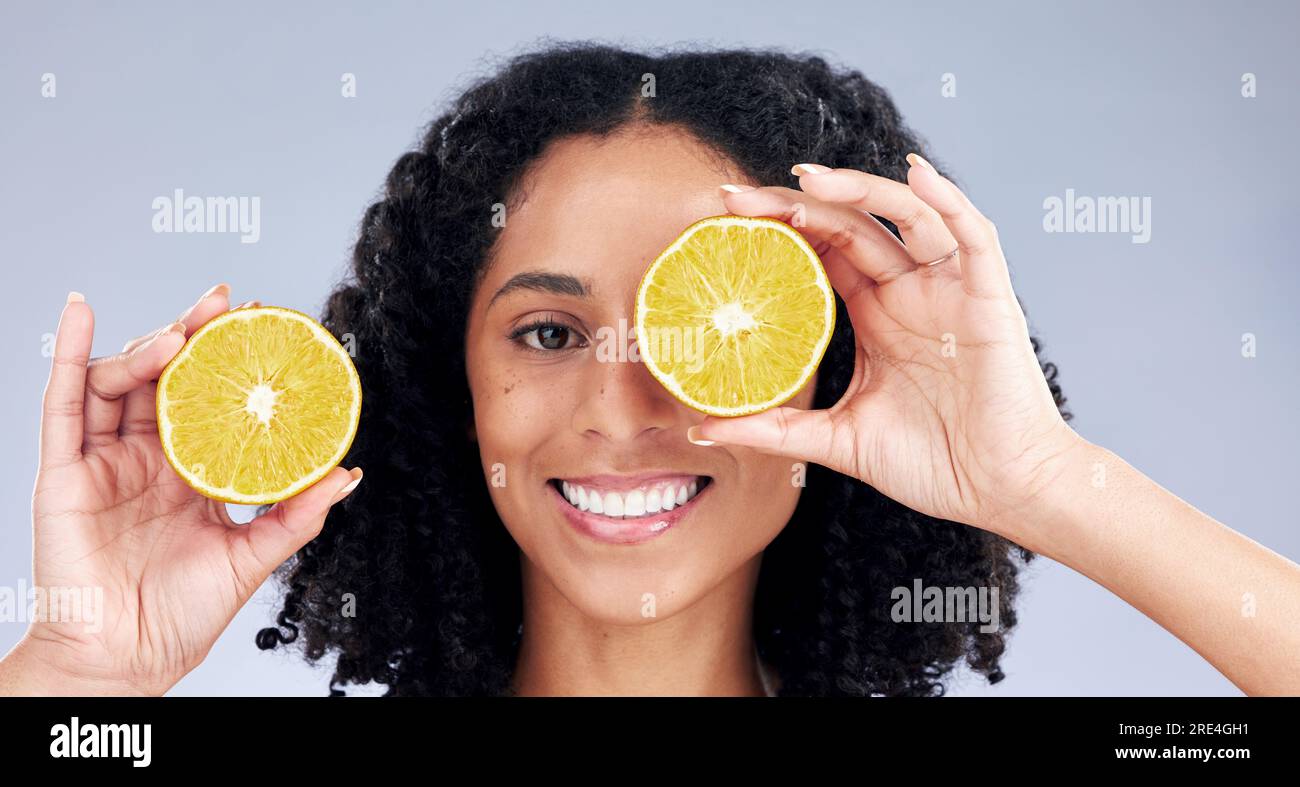 Portrait, skincare and woman with lemon eye for wellness or nutrition ...