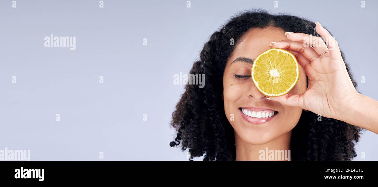 Skincare, wellness and woman with lemon eye or fruit for nutrition in ...