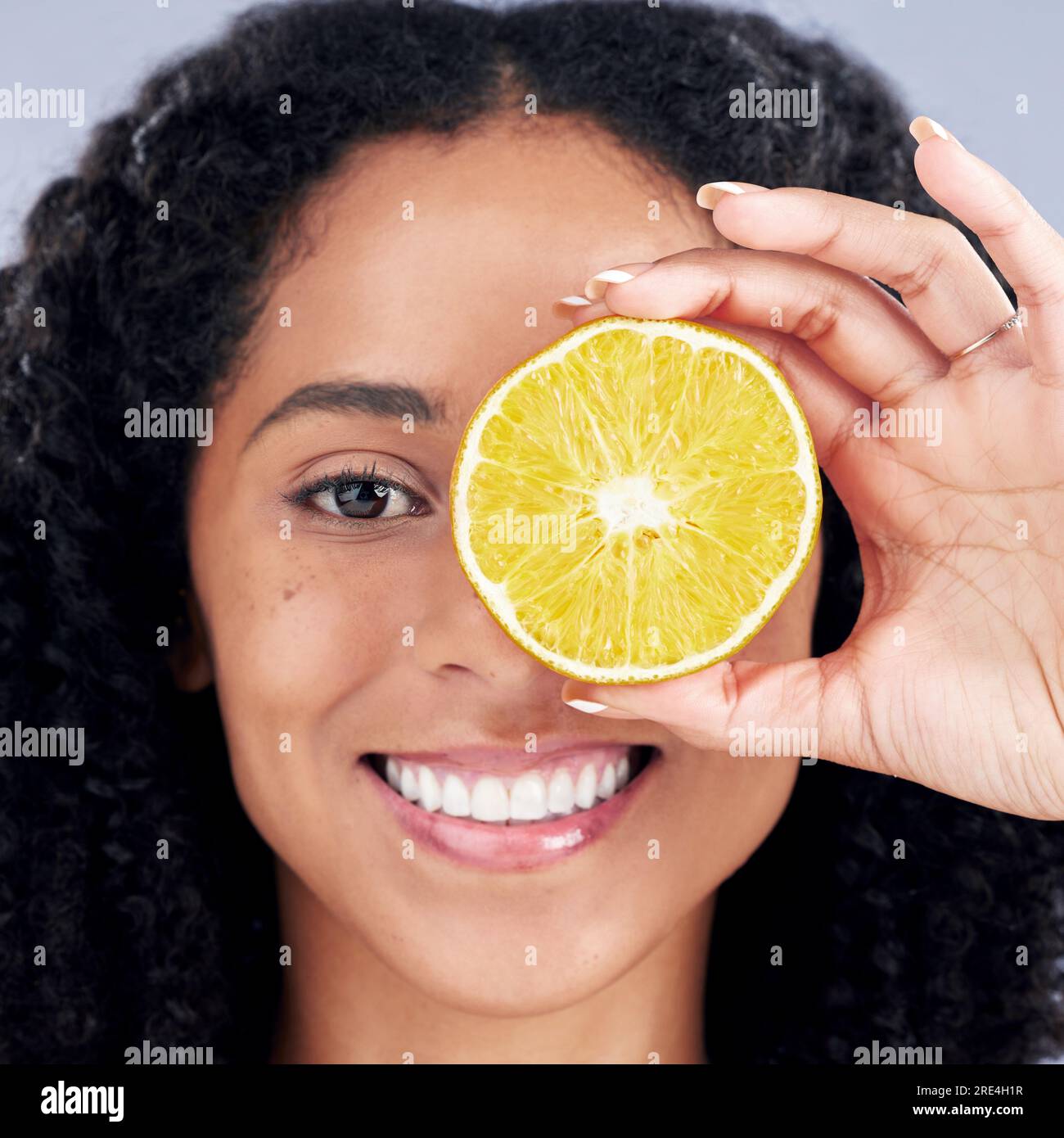 Portrait, wellness and woman with lemon eye for nutrition in closeup in ...