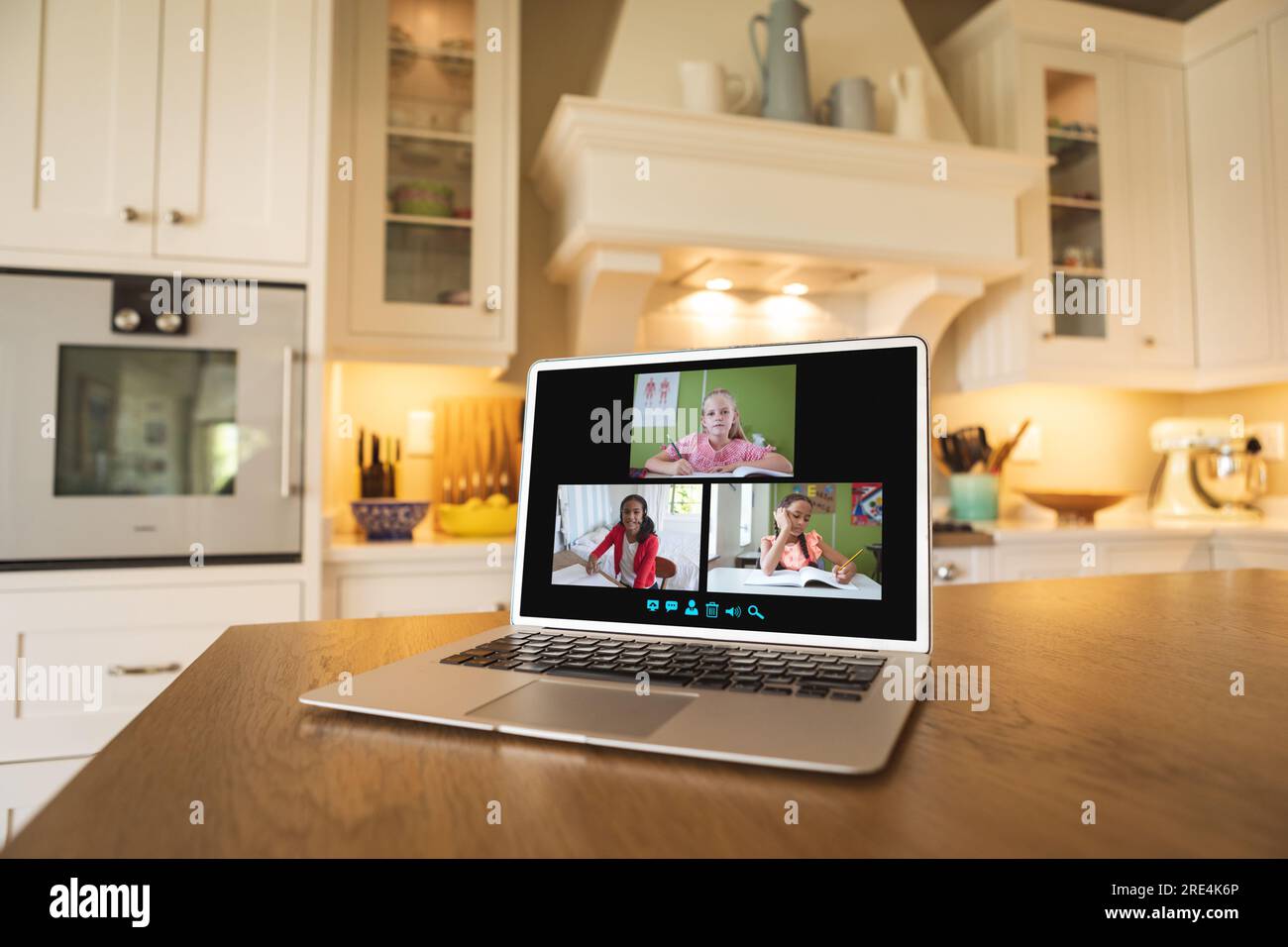 Laptop with video conference with diverse students on a table in the ...